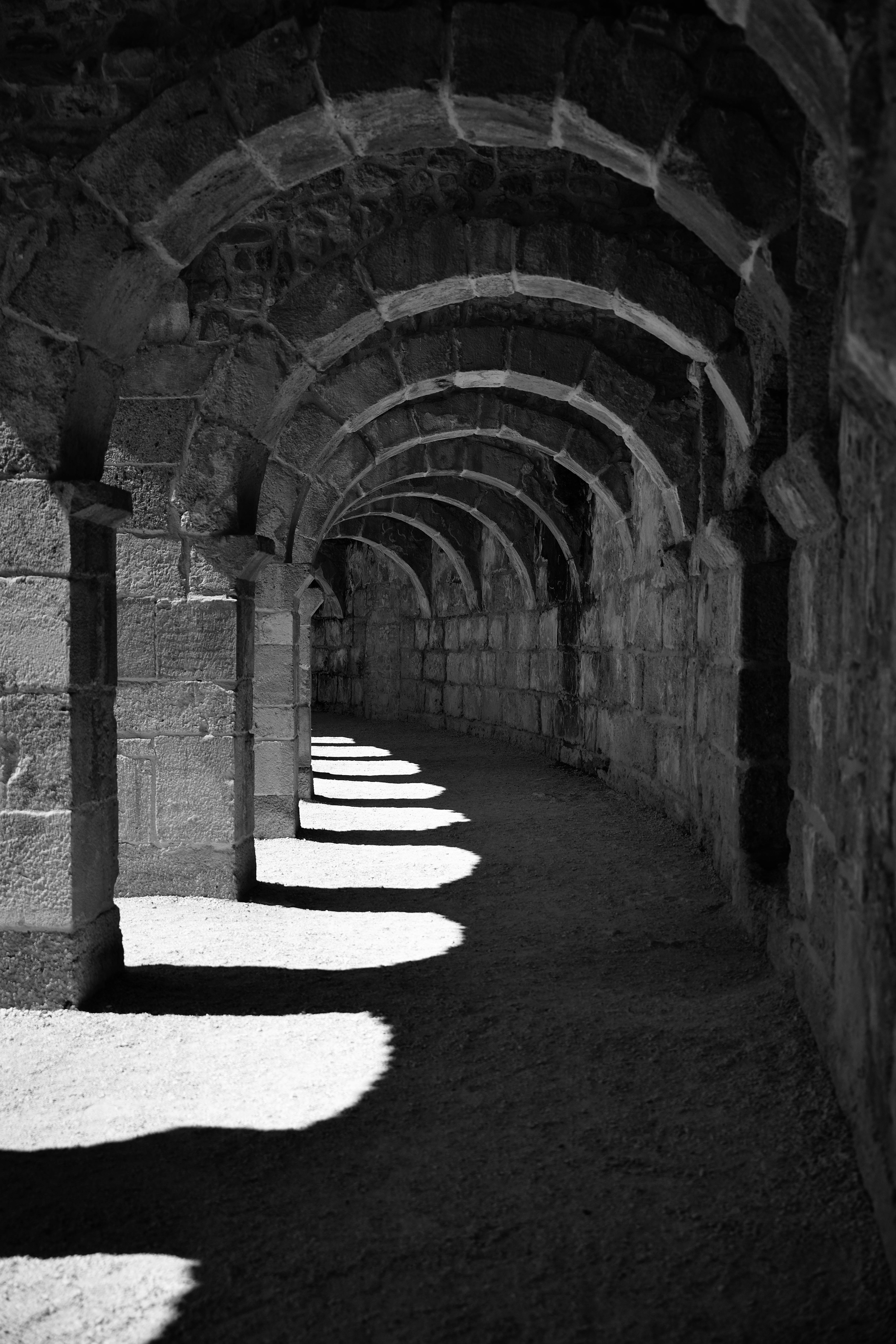 Historic Stone Archway with Dramatic Shadows · Free Stock Photo