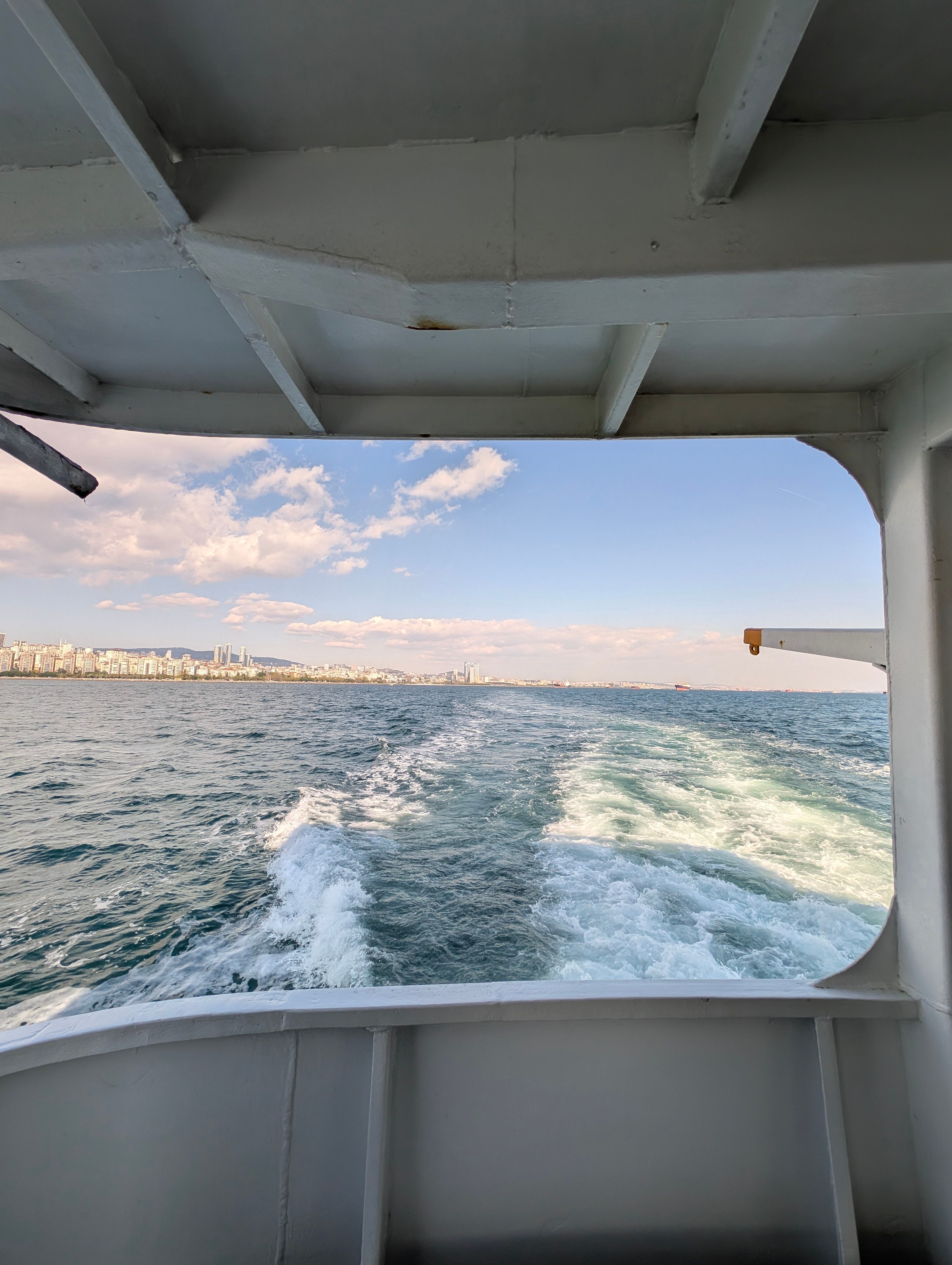 Ocean View from a Boat with City Skyline · Free Stock Photo