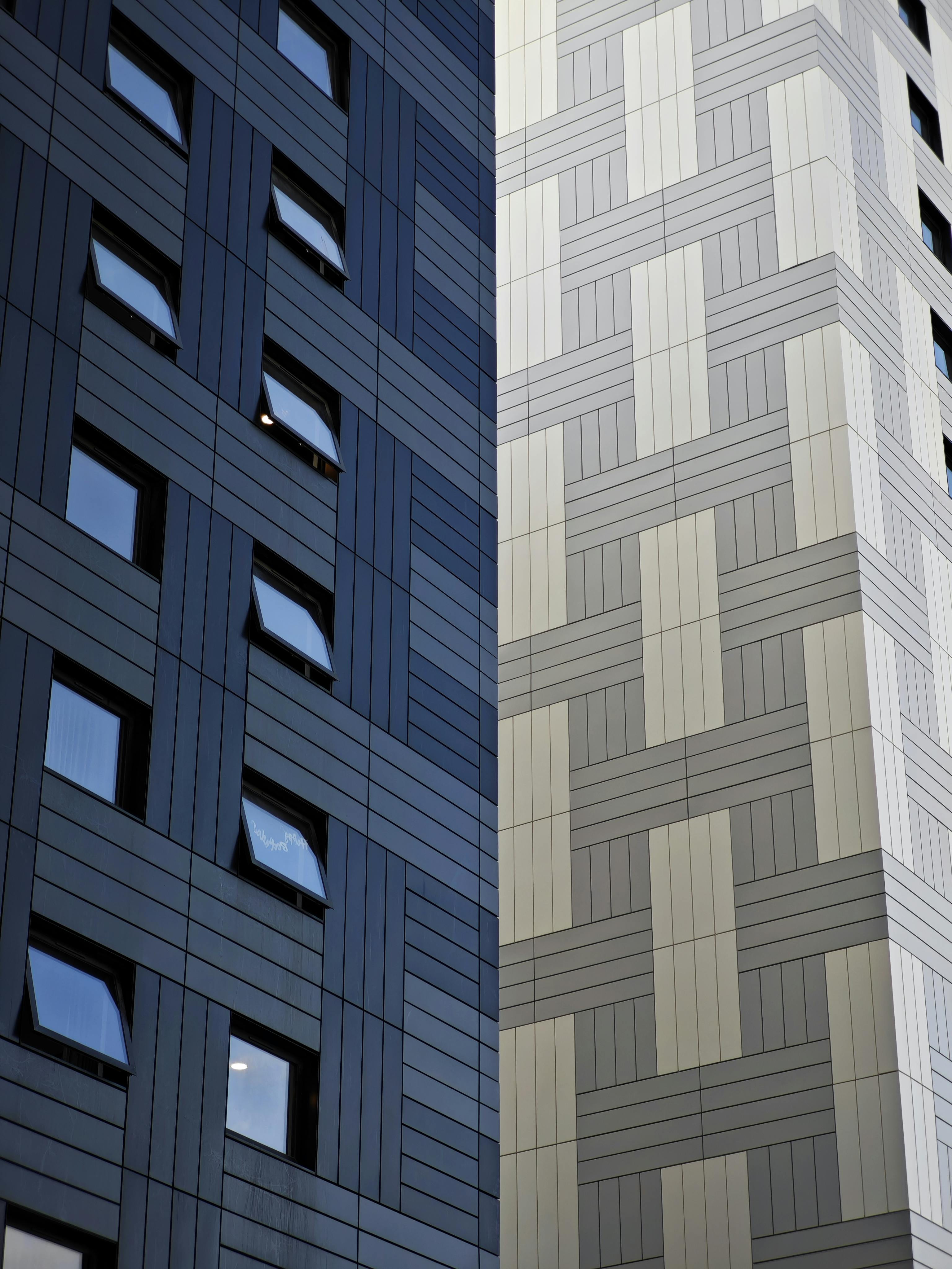 Modern Architectural Facade with Geometric Patterns · Free Stock Photo