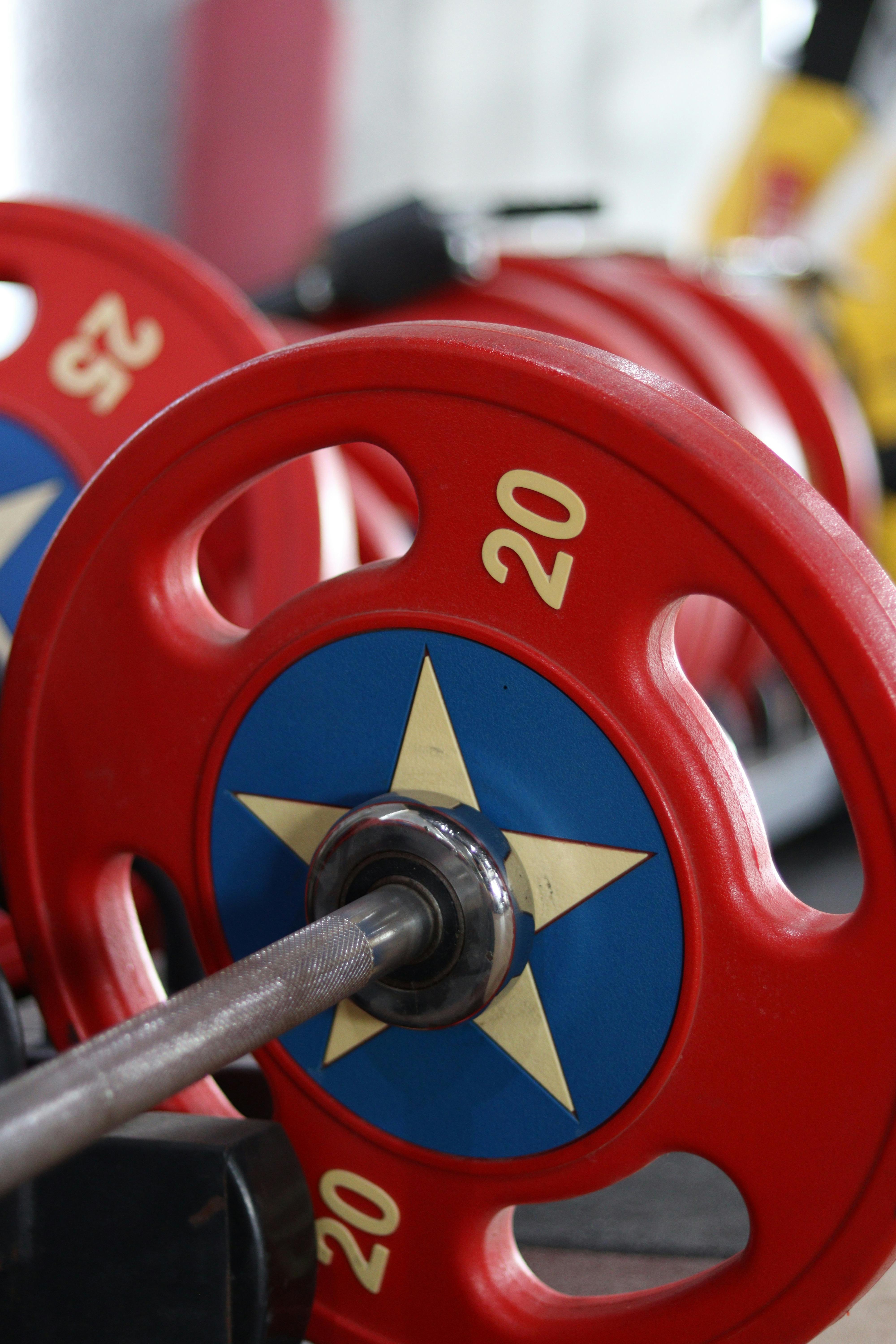 Close-up of Colorful Weight Plates in Gym · Free Stock Photo