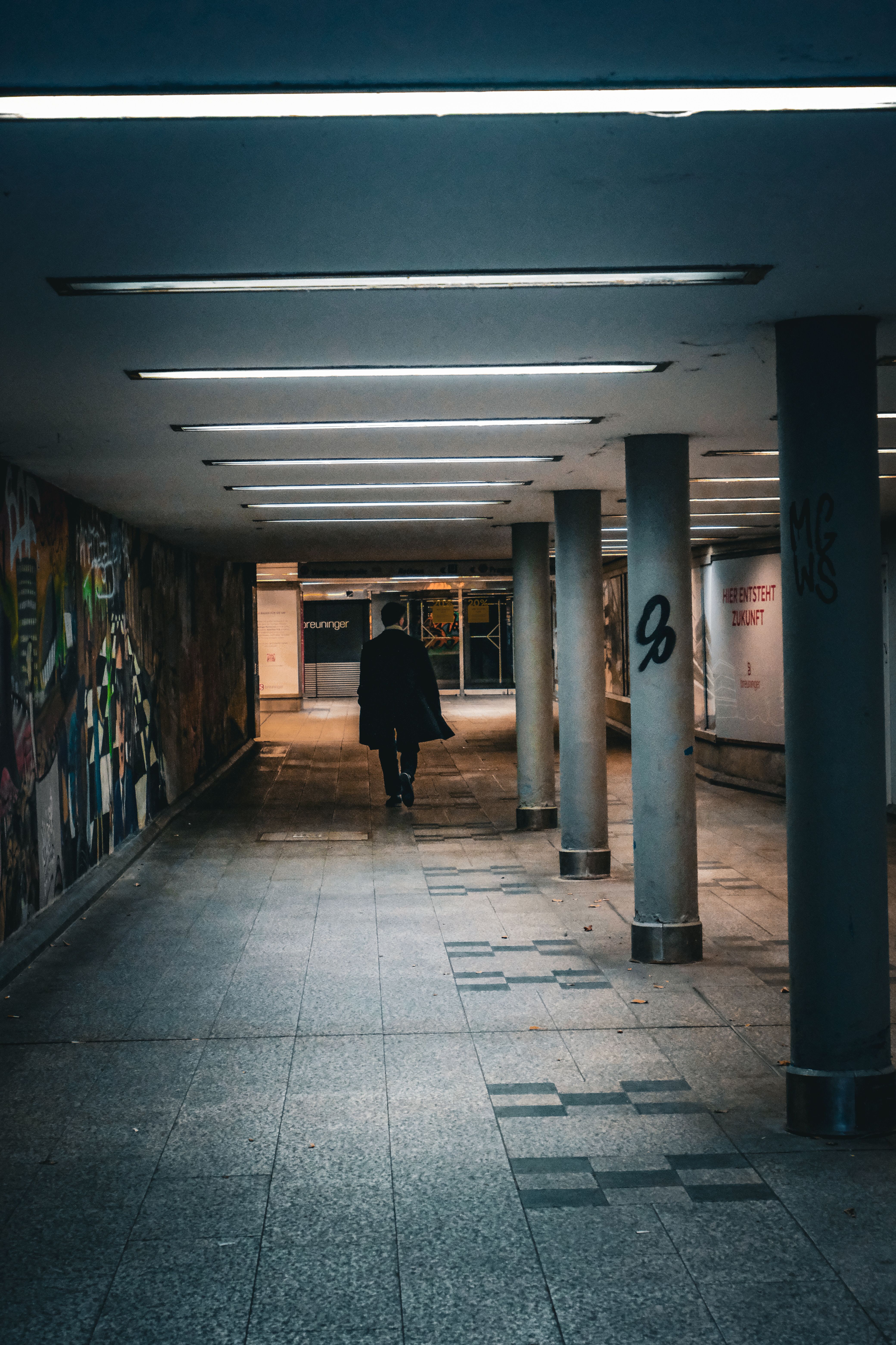 Moody Urban Subway Walkway with Graffiti Art · Free Stock Photo