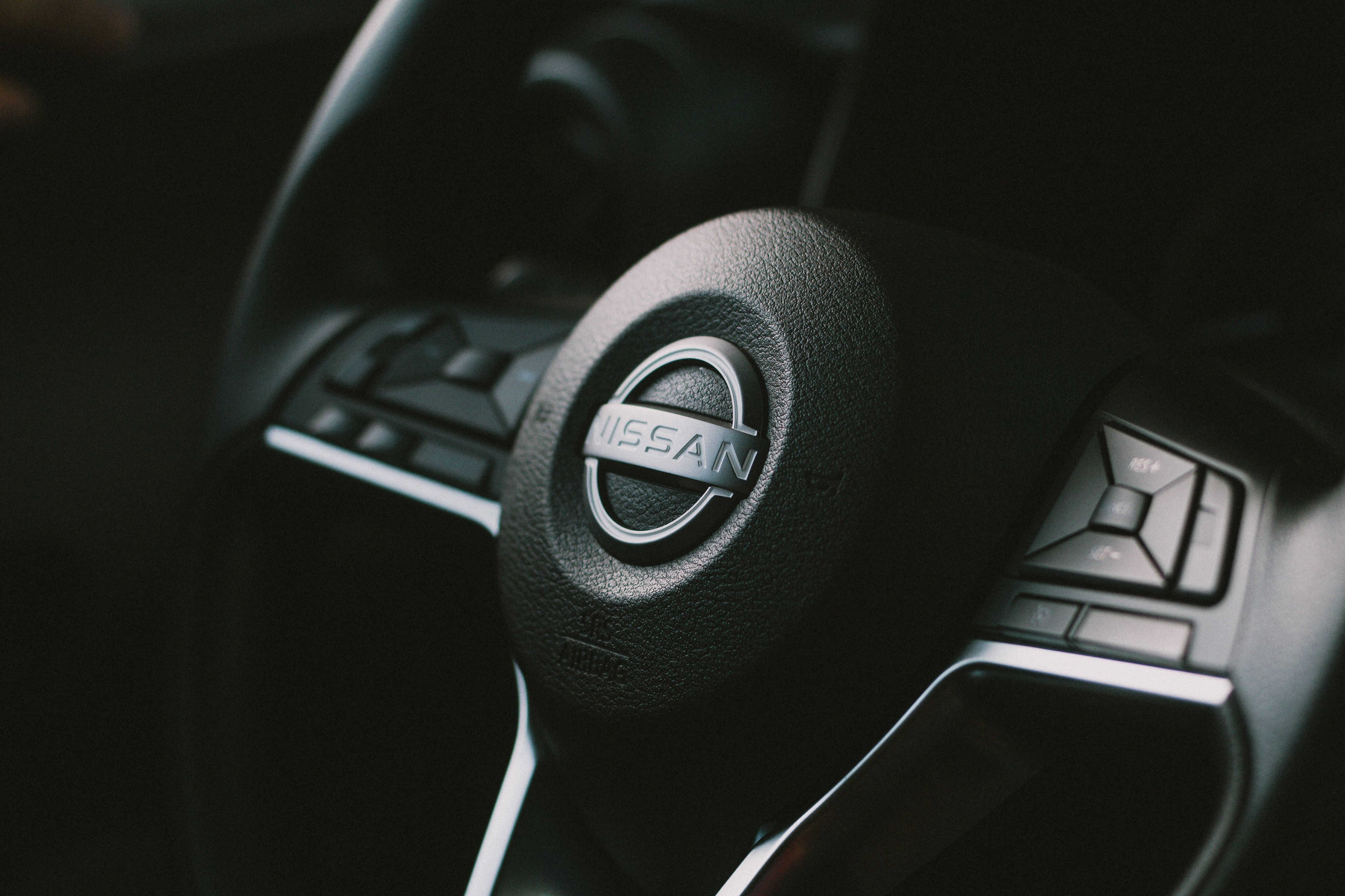 Close-up of a Nissan Steering Wheel · Free Stock Photo
