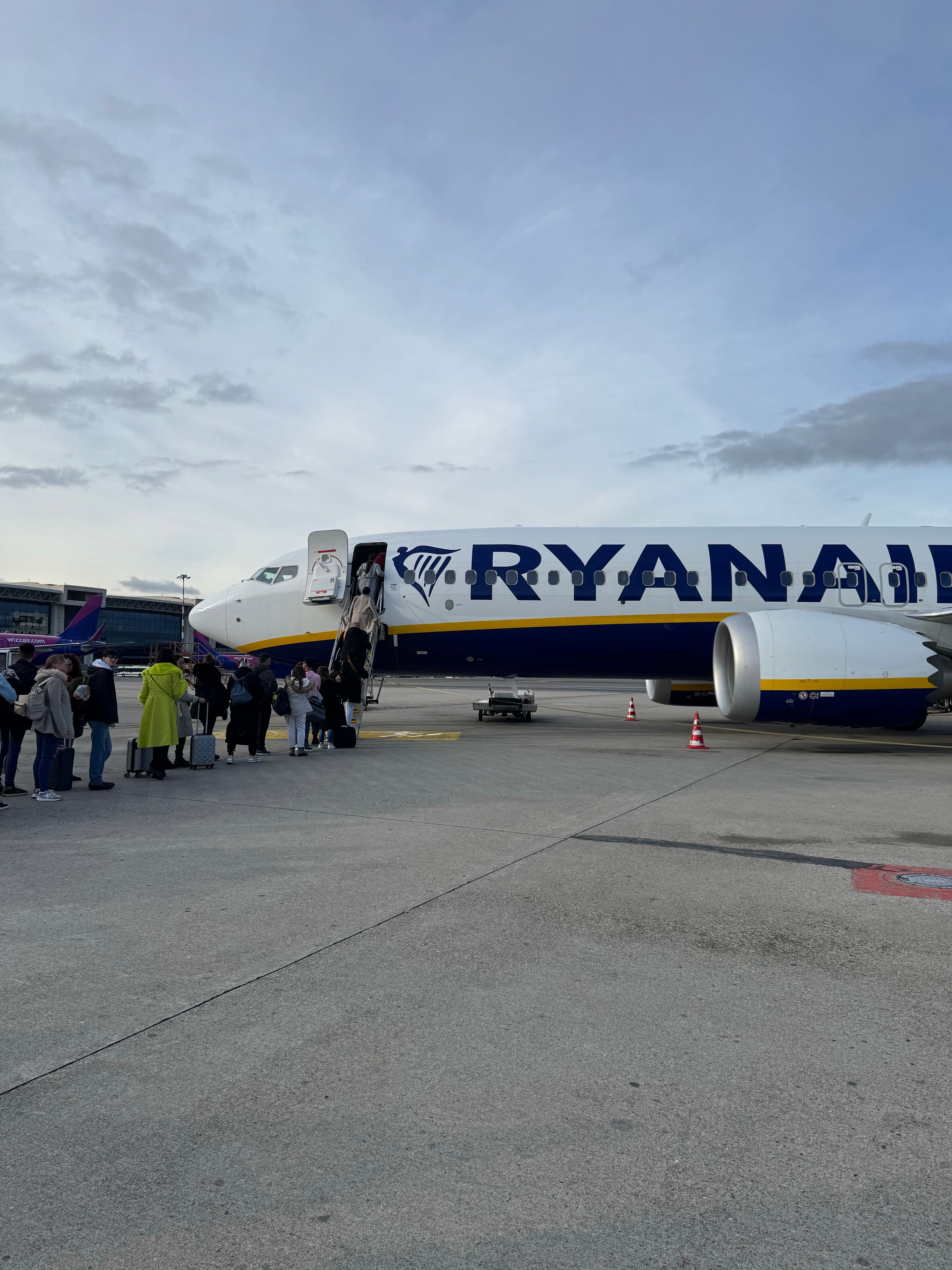 Passengers Boarding Ryanair at Airport Tarmac · Free Stock Photo
