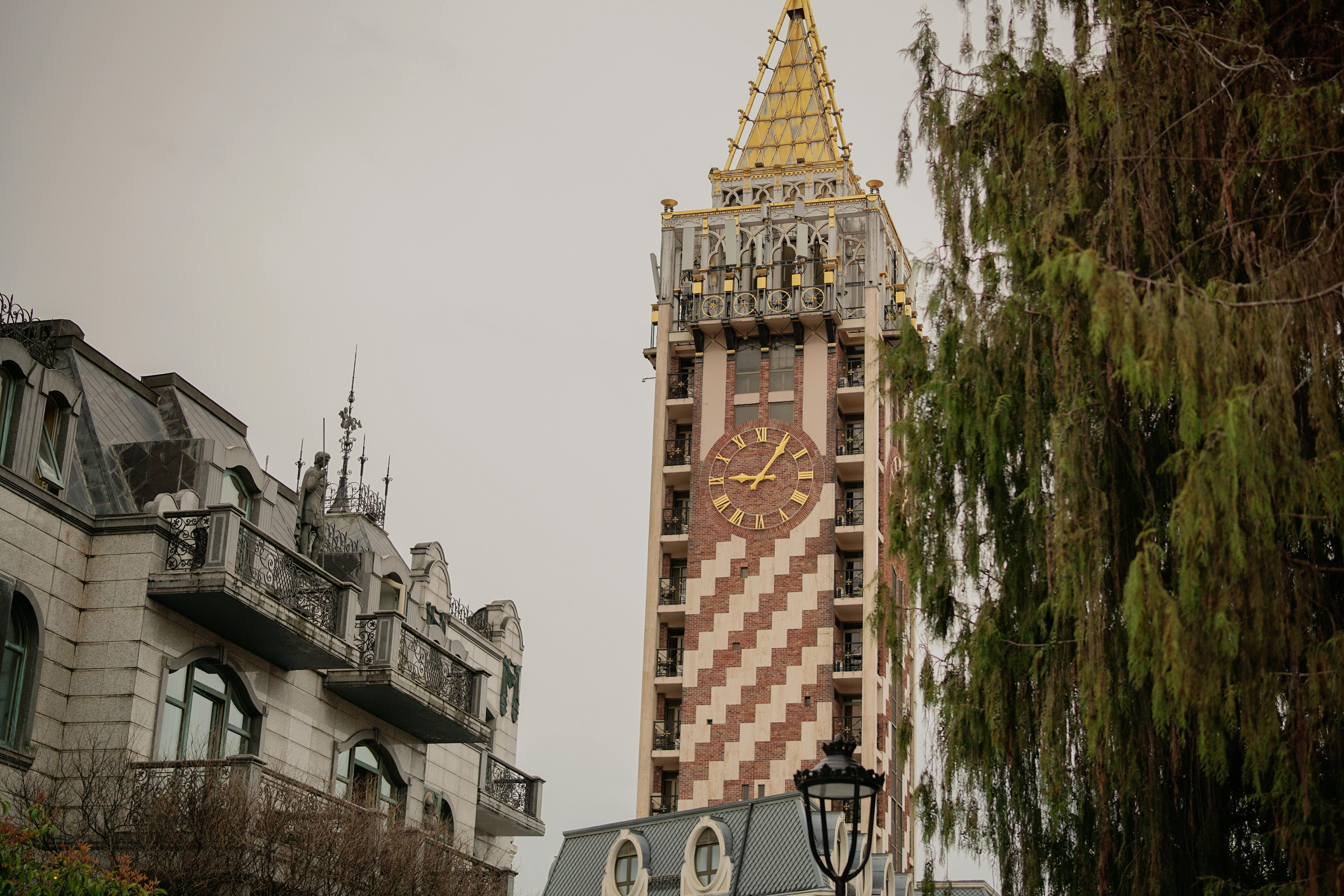 Ornate Clock Tower in Urban Setting · Free Stock Photo