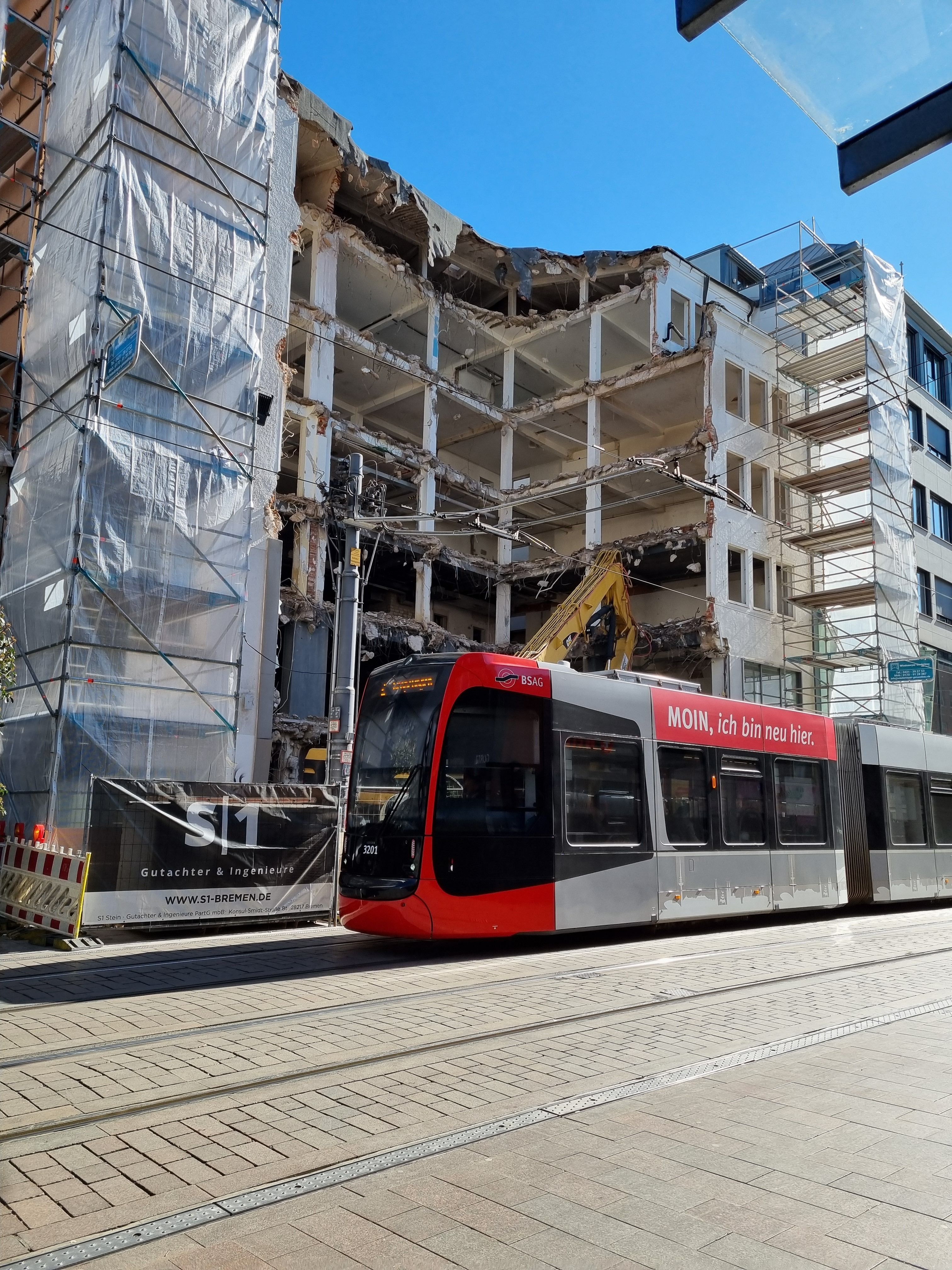 Modern Tram Passing Construction Site in City · Free Stock Photo