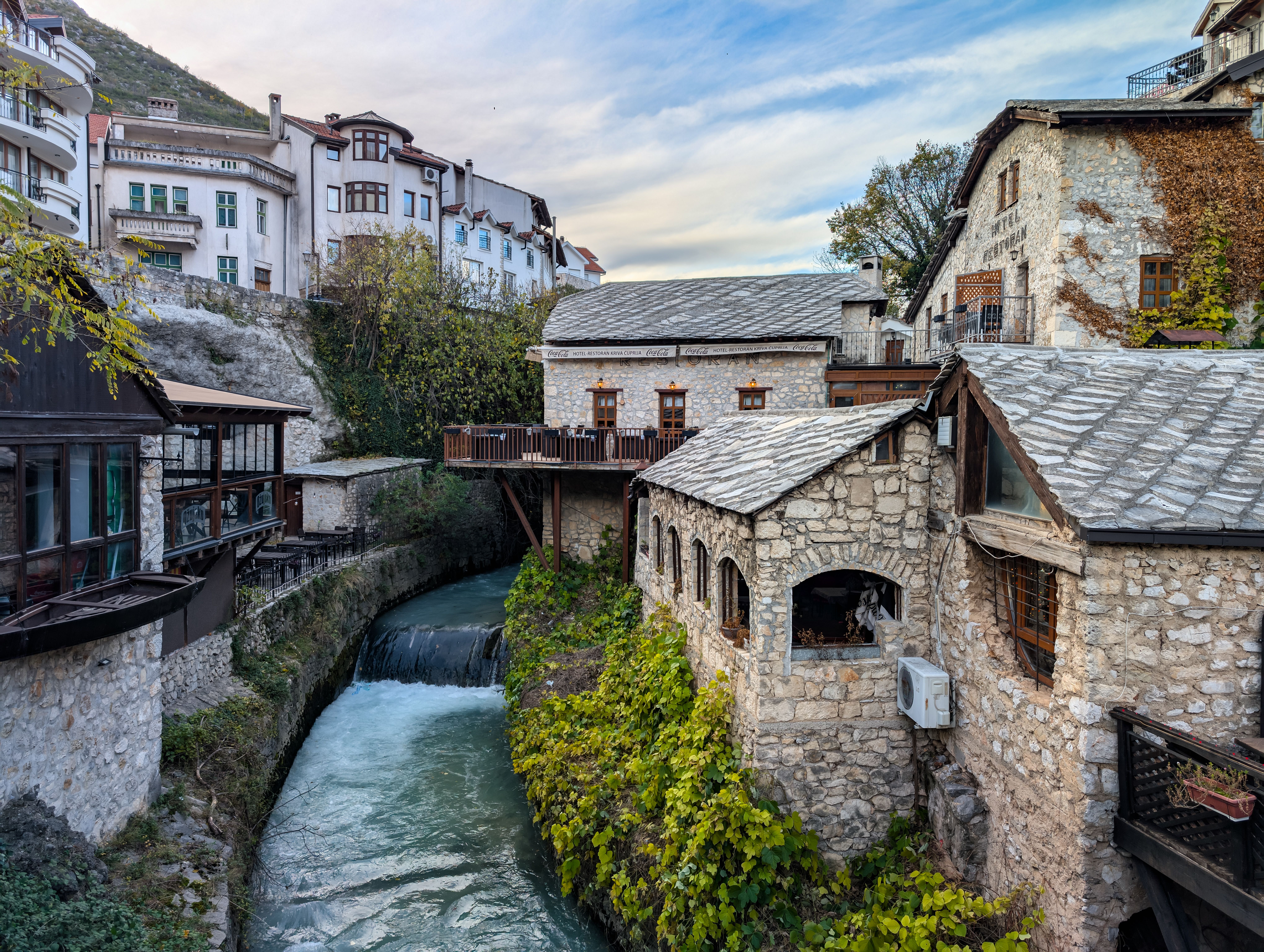 Historic Stone Architecture by River in Europe · Free Stock Photo