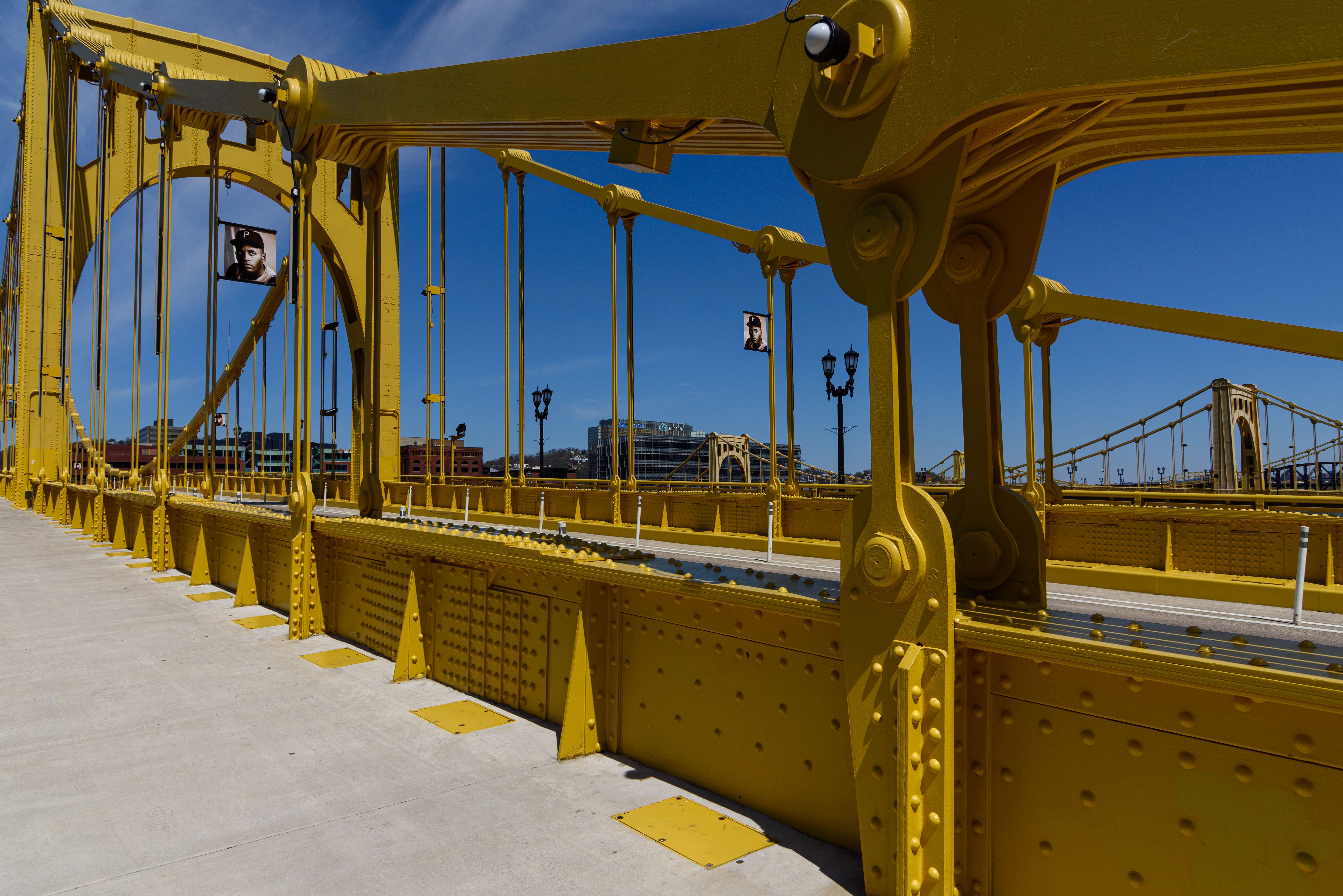 Iconic Yellow Suspension Bridge in Bright Sunlight · Free Stock Photo