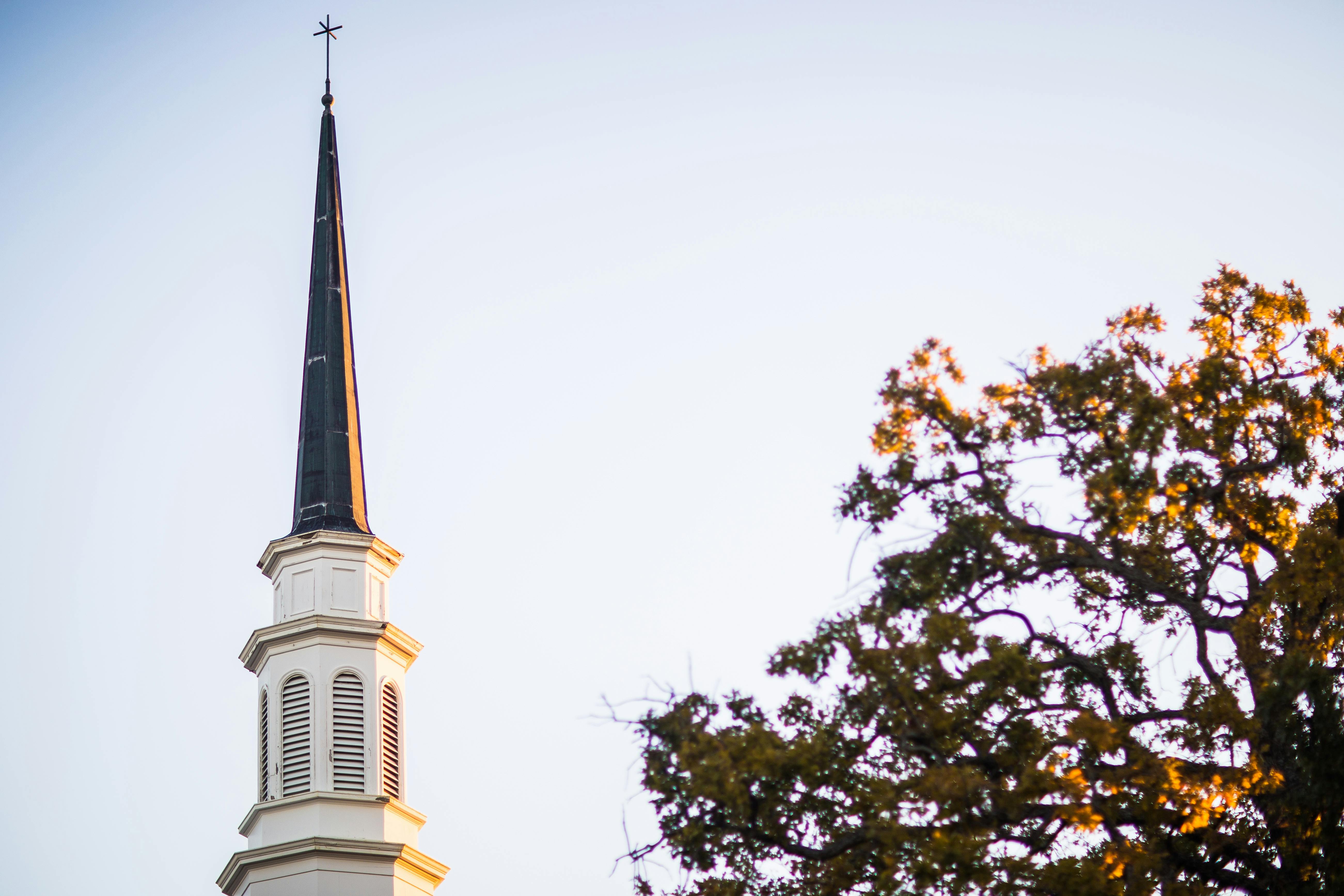 Buildings and Towers with Spires Under Bright Sky · Free Stock Photo