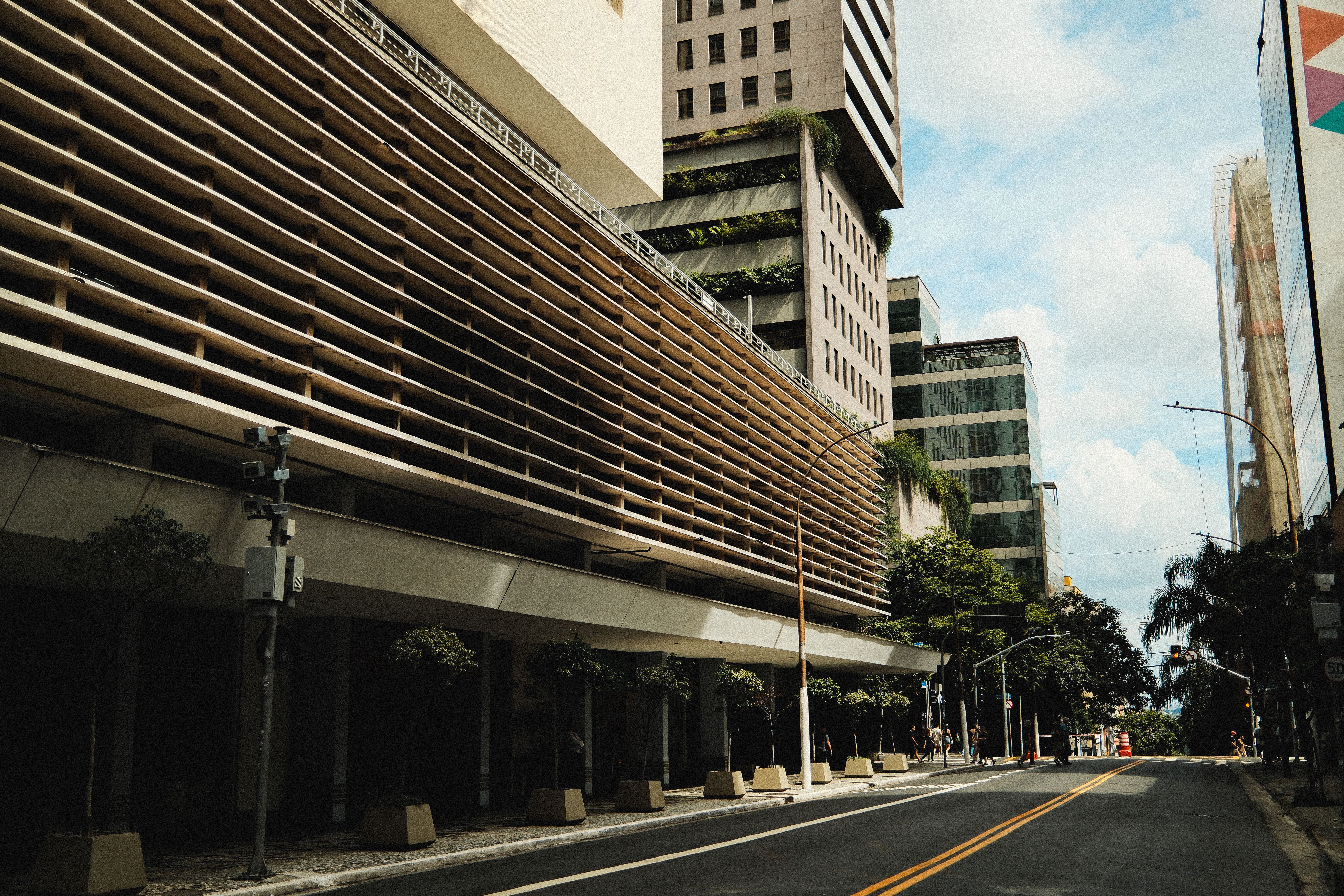 Modern Urban Street with Green Architecture · Free Stock Photo