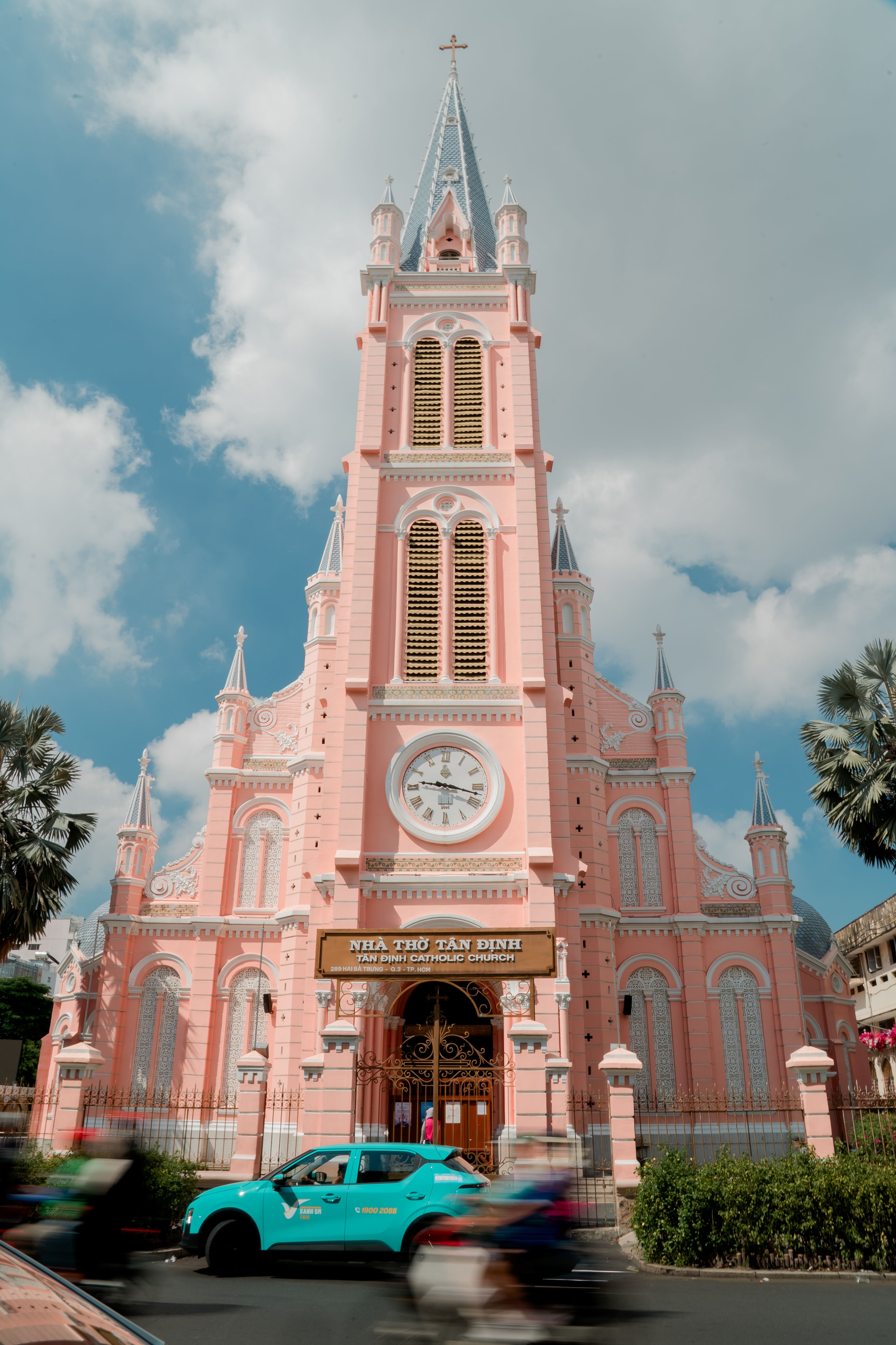Pink Gothic Revival Church in Vibrant City Setting · Free Stock Photo