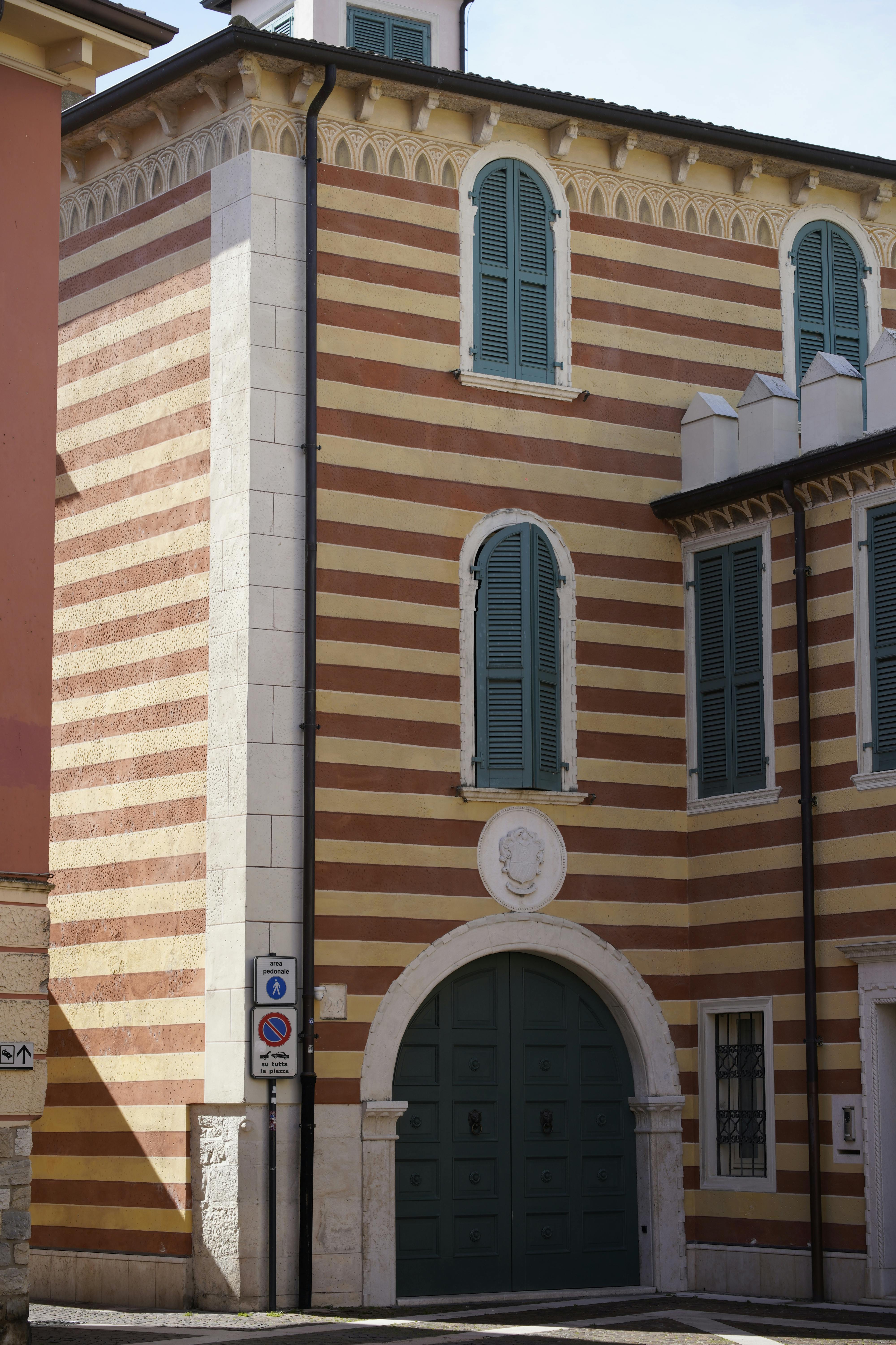 Striped Facade of Historic Italian Building · Free Stock Photo