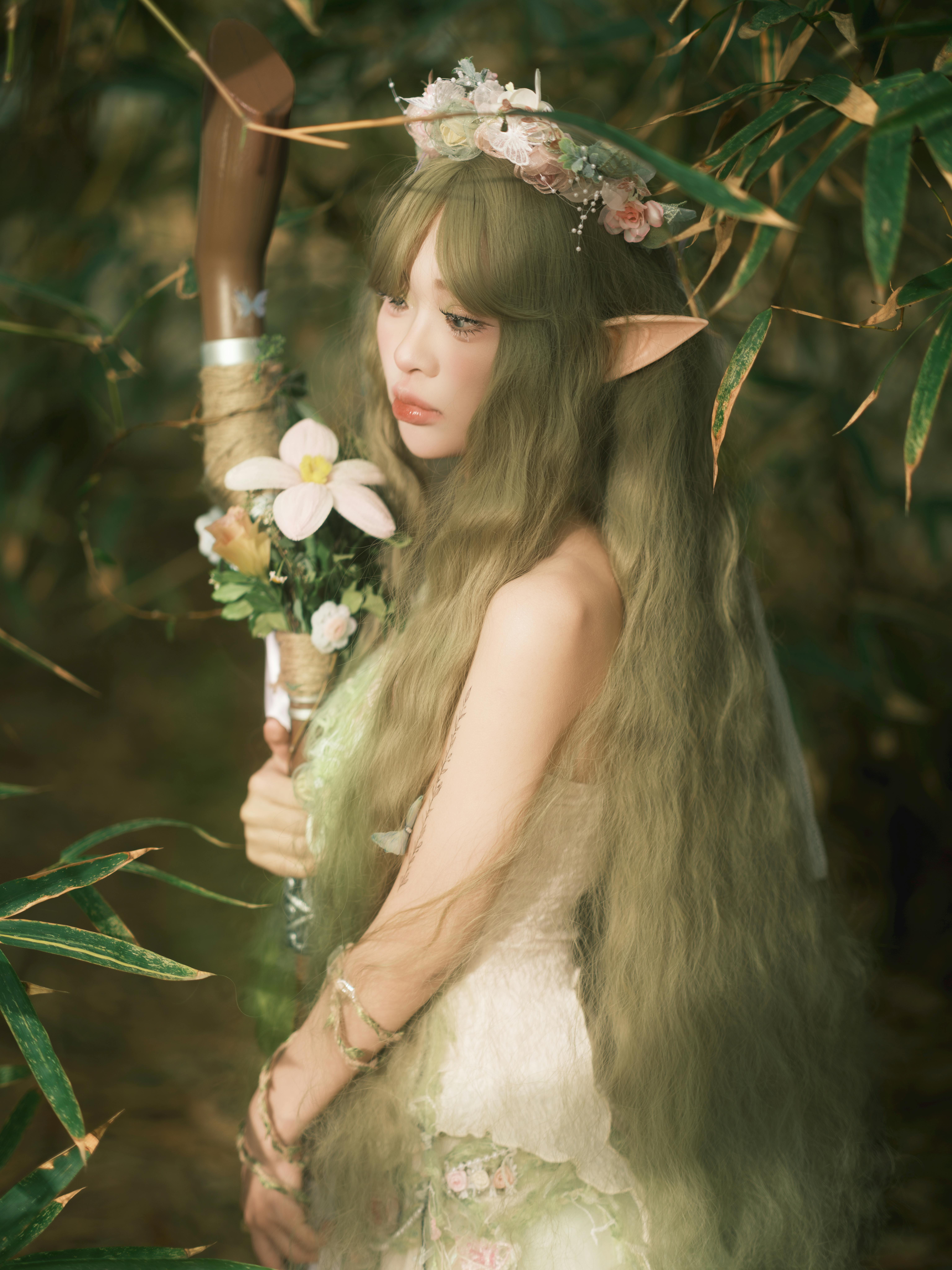 Enchanting Forest Elf in Lush Greenery · Free Stock Photo