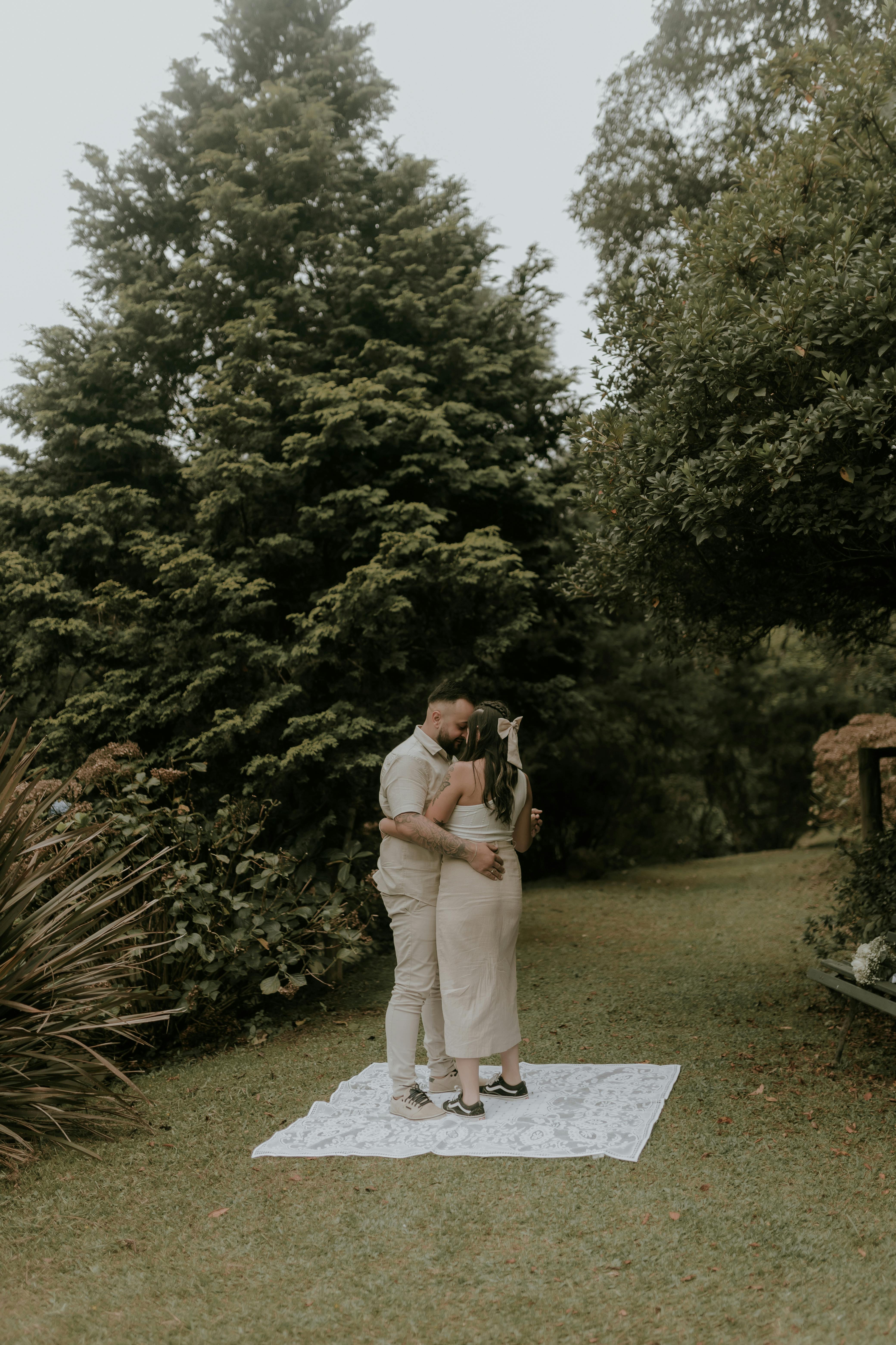 Romantic Outdoor Proposal in Serene Garden Setting · Free Stock Photo