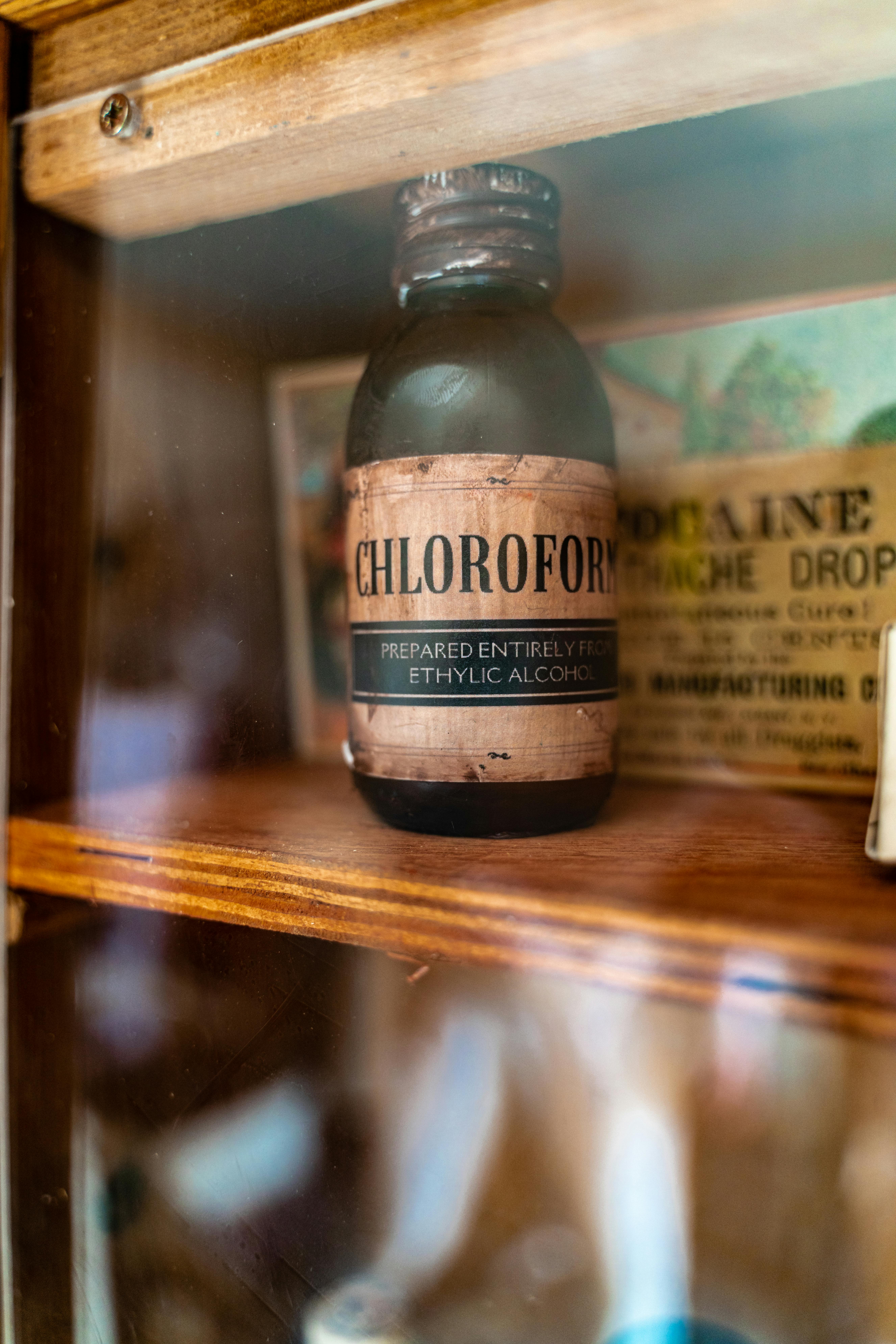 Vintage Chloroform Bottle on Wooden Shelf · Free Stock Photo