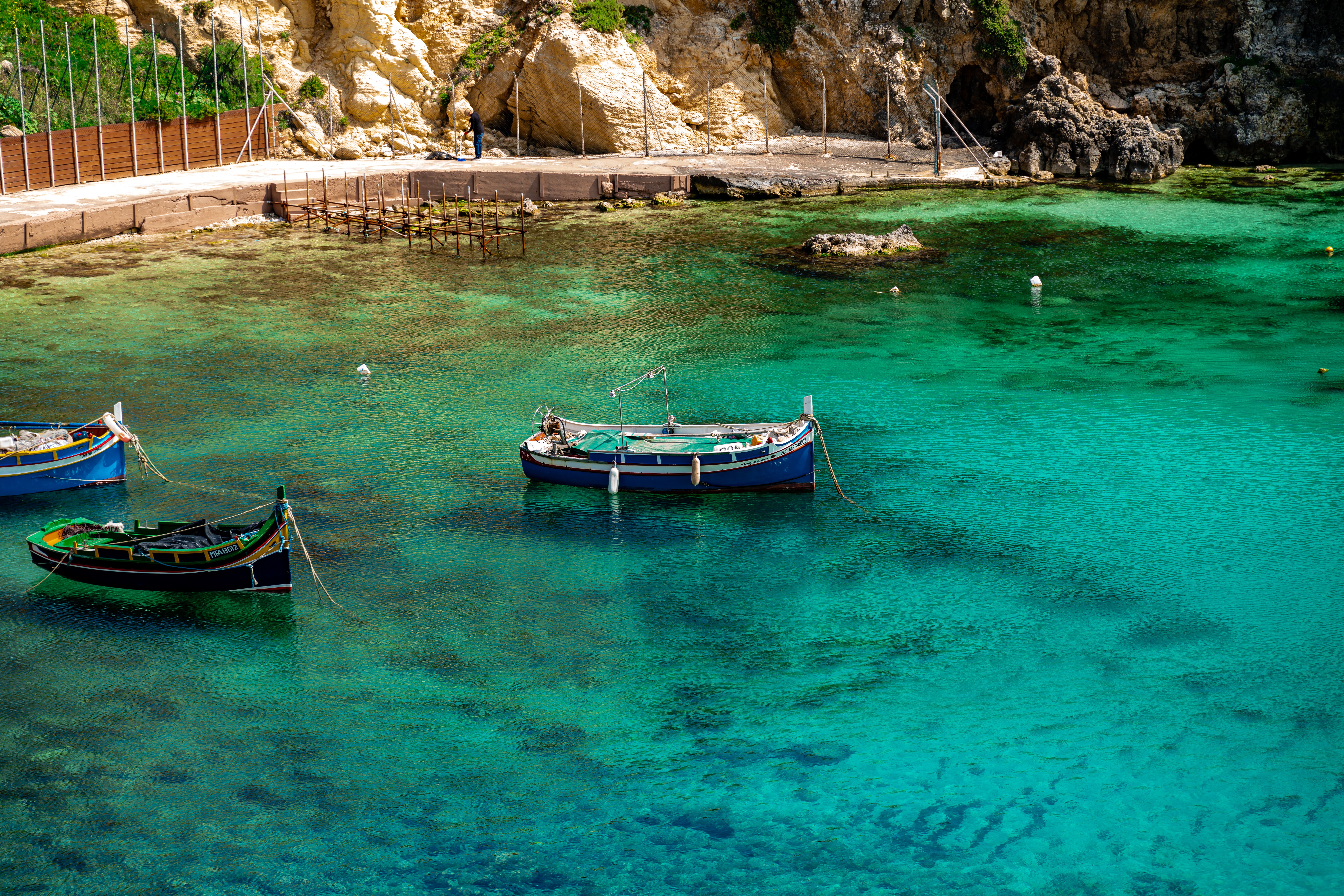 Vibrant Boats in the Azure Waters of Malta · Free Stock Photo