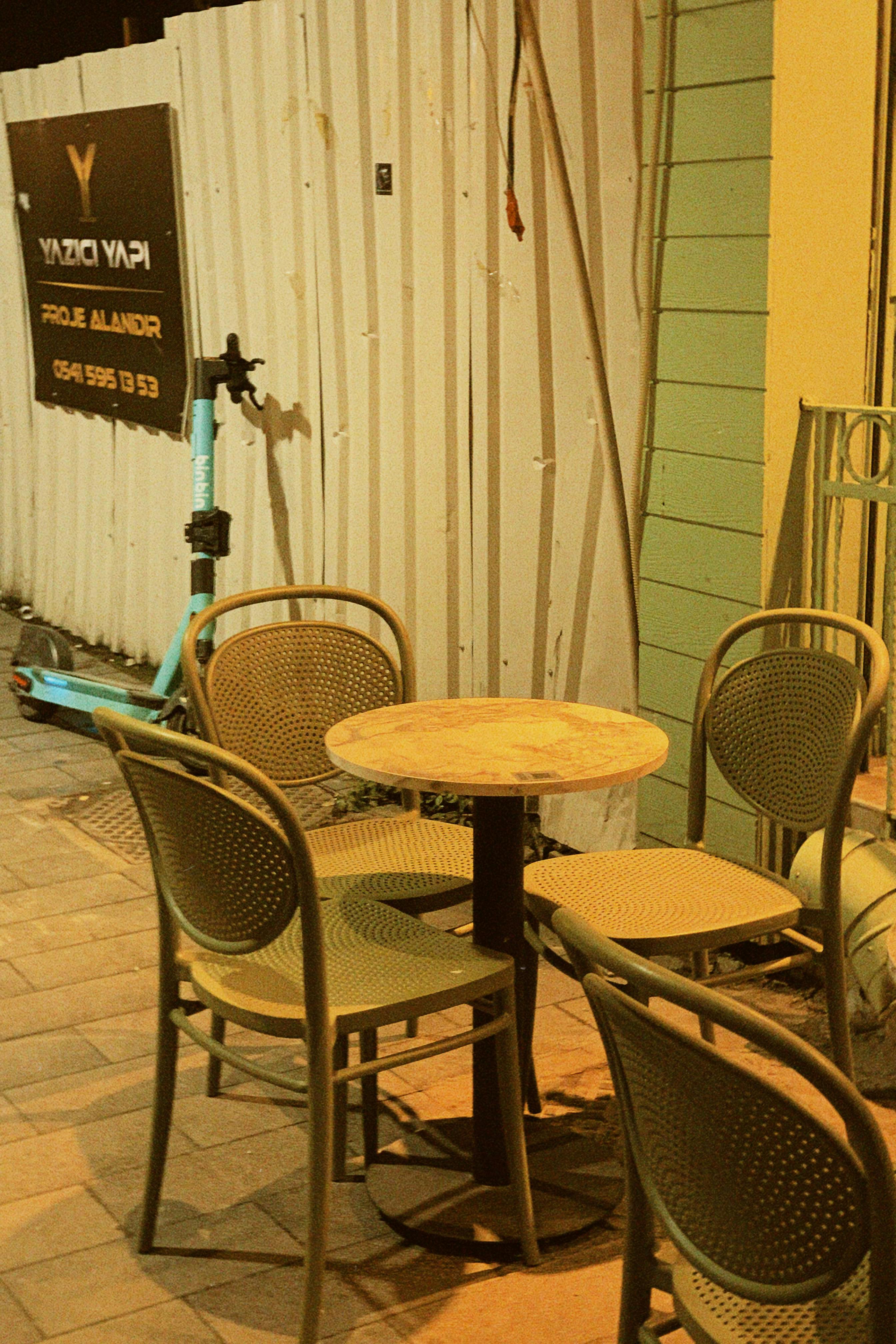 Cozy Outdoor Cafe Setting at Night · Free Stock Photo