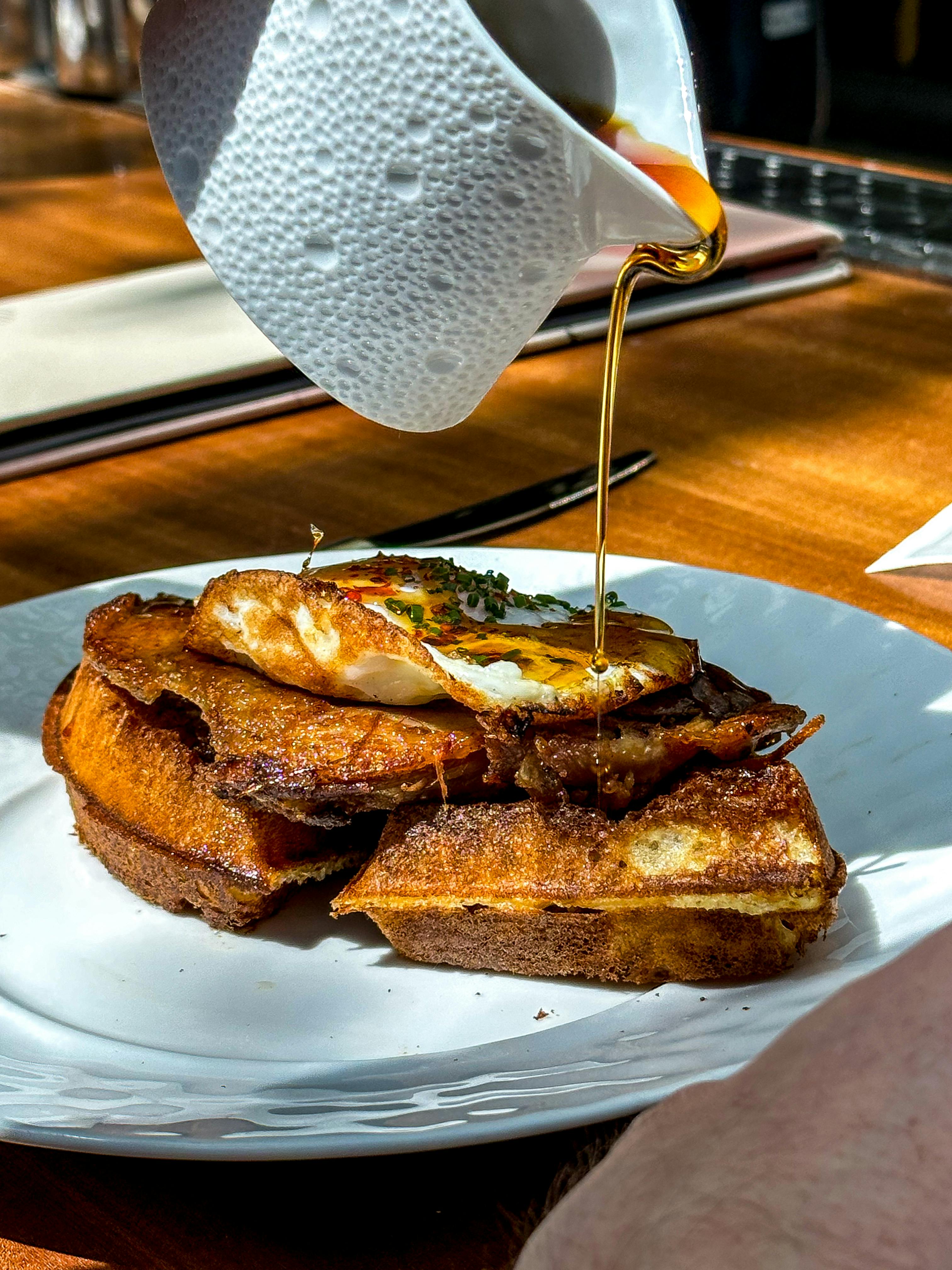 Savory Brunch with Fried Egg and Syrup Delight · Free Stock Photo