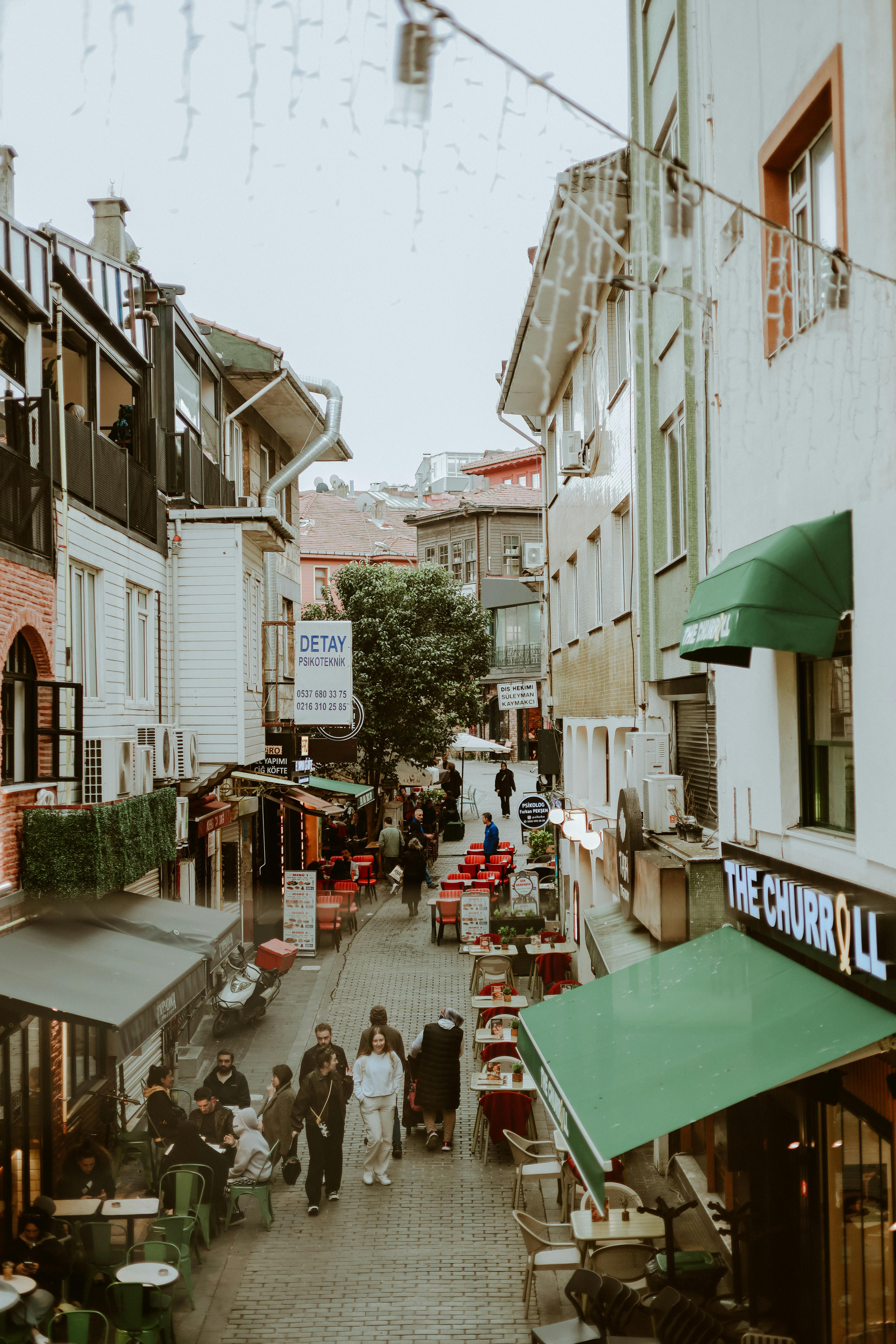 Charming European Street with Cafes and Shops · Free Stock Photo
