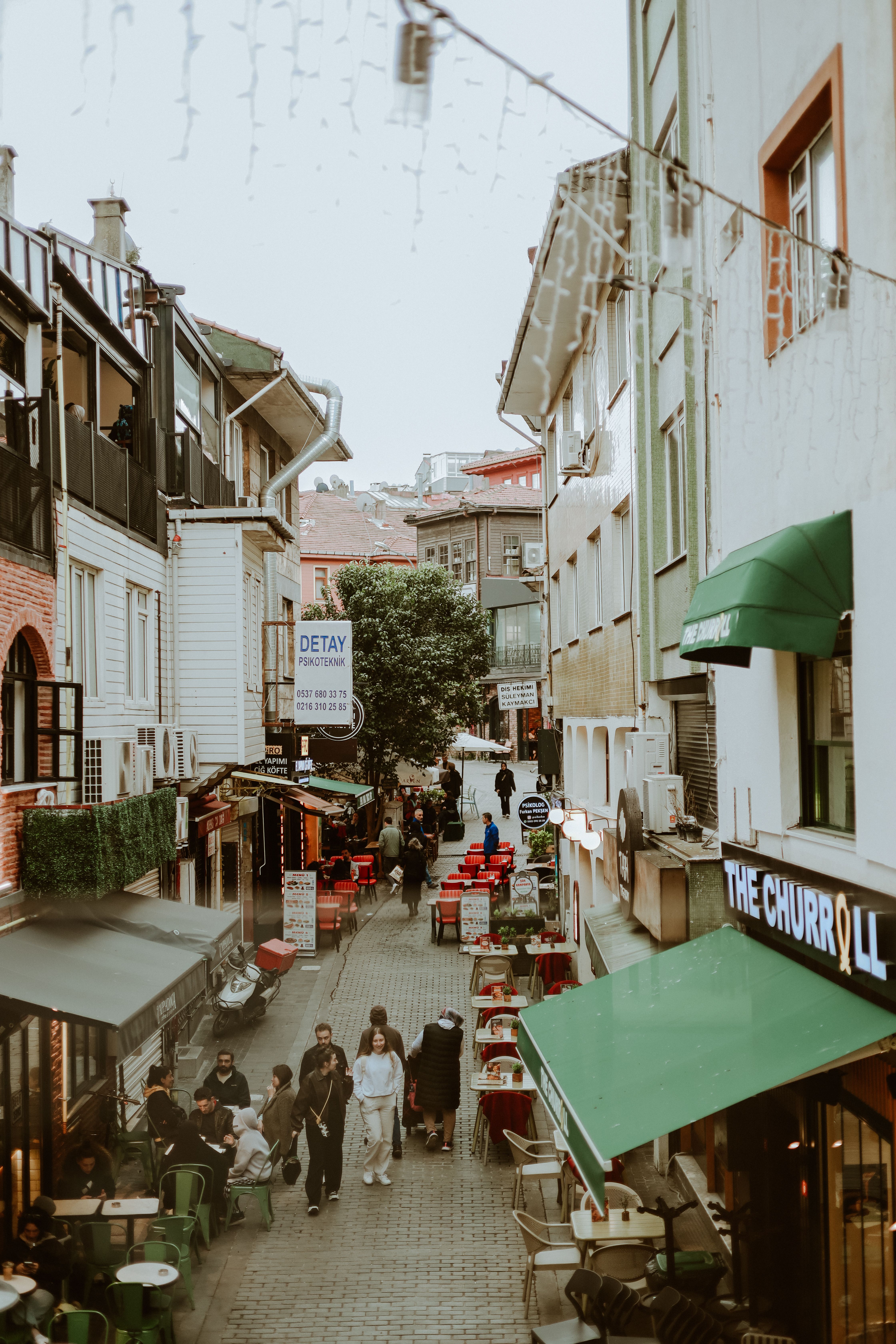 Charming European Street with Cafes and Shops · Free Stock Photo