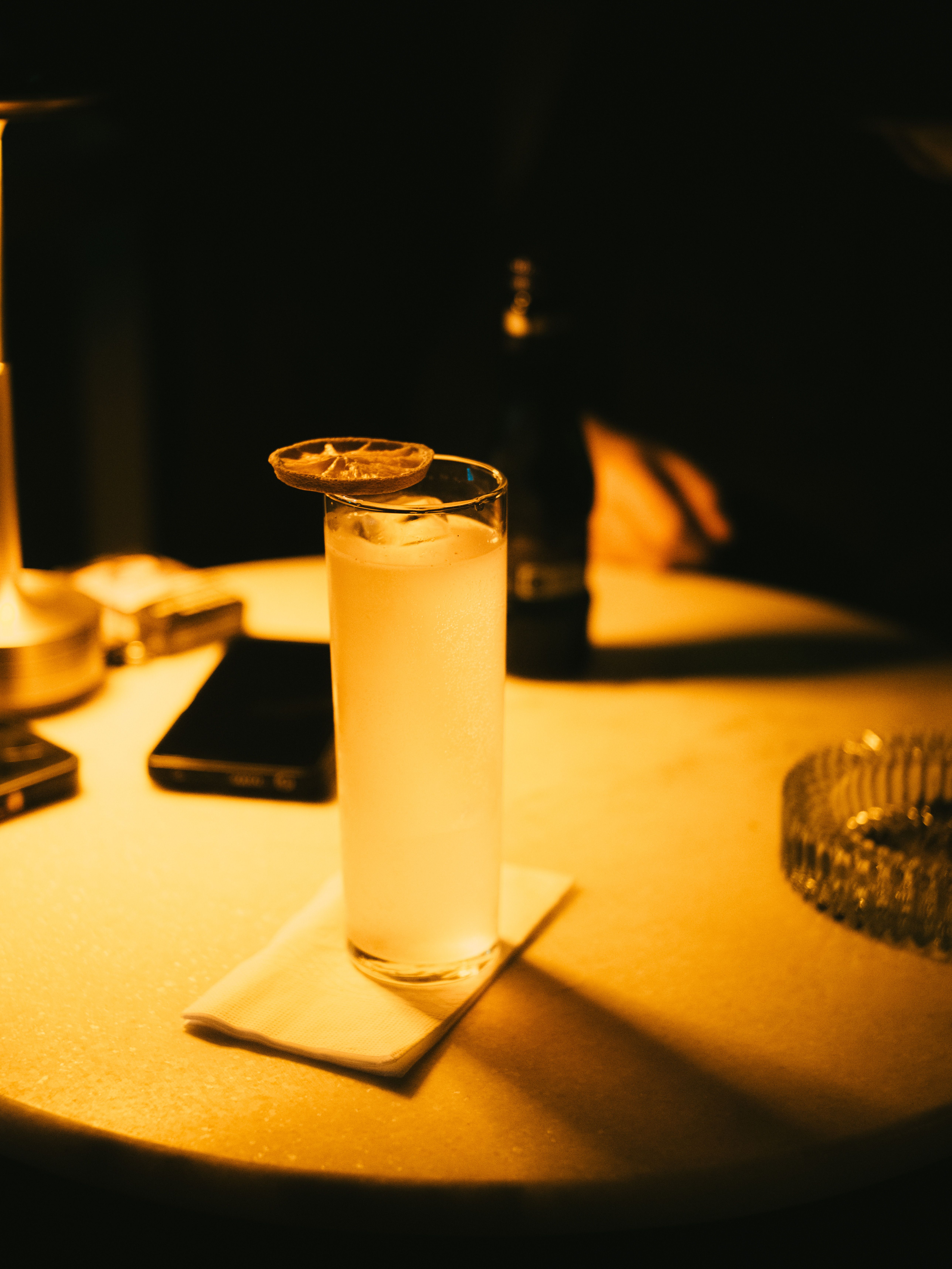 Elegant Cocktail with Lemon Slice Garnish in Dim Bar Setting · Free ...