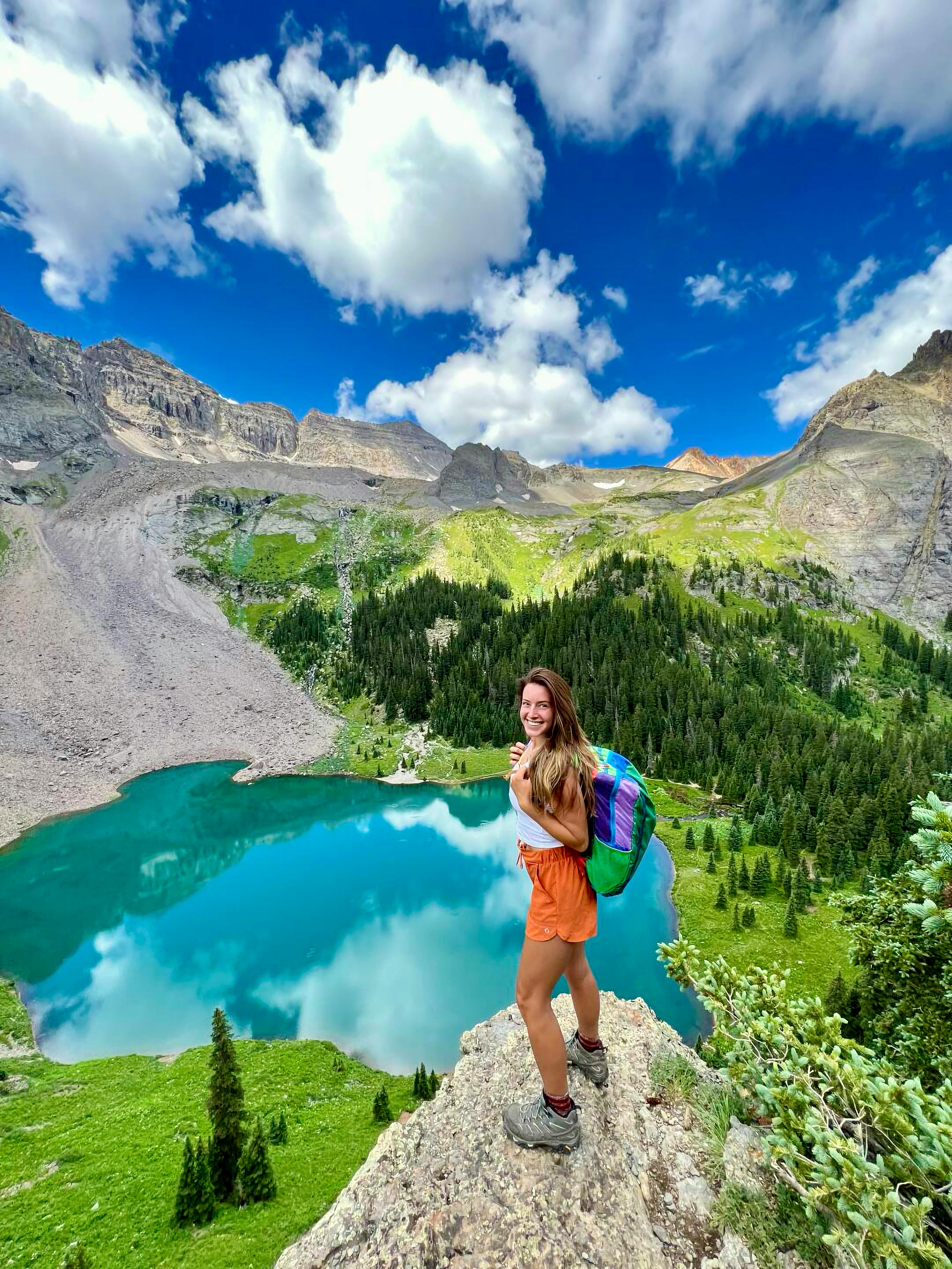 Hiker Enjoying Scenic Mountain Lake View · Free Stock Photo