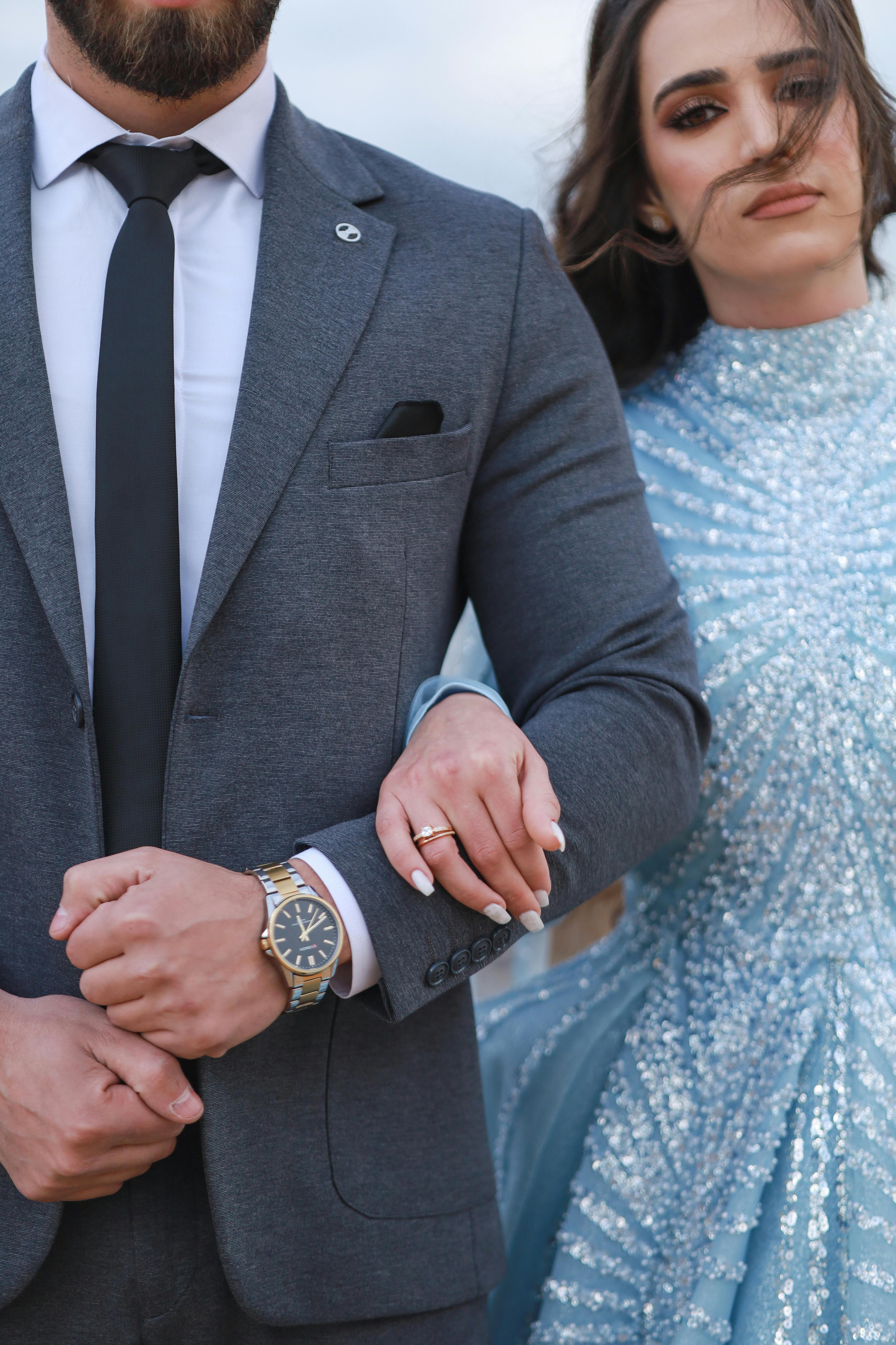 Elegant Couple in Formal Attire Embracing · Free Stock Photo