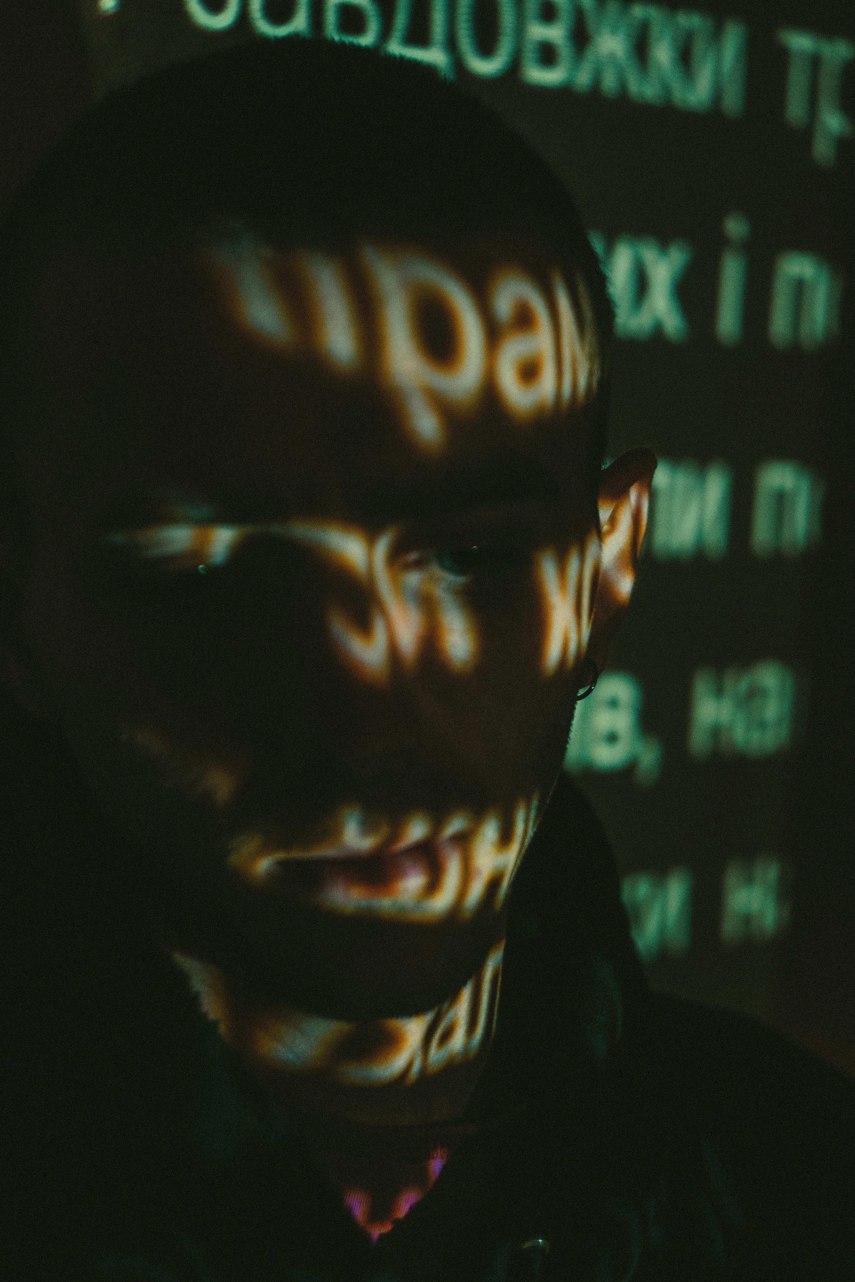 Intriguing Portrait with Projected Text · Free Stock Photo