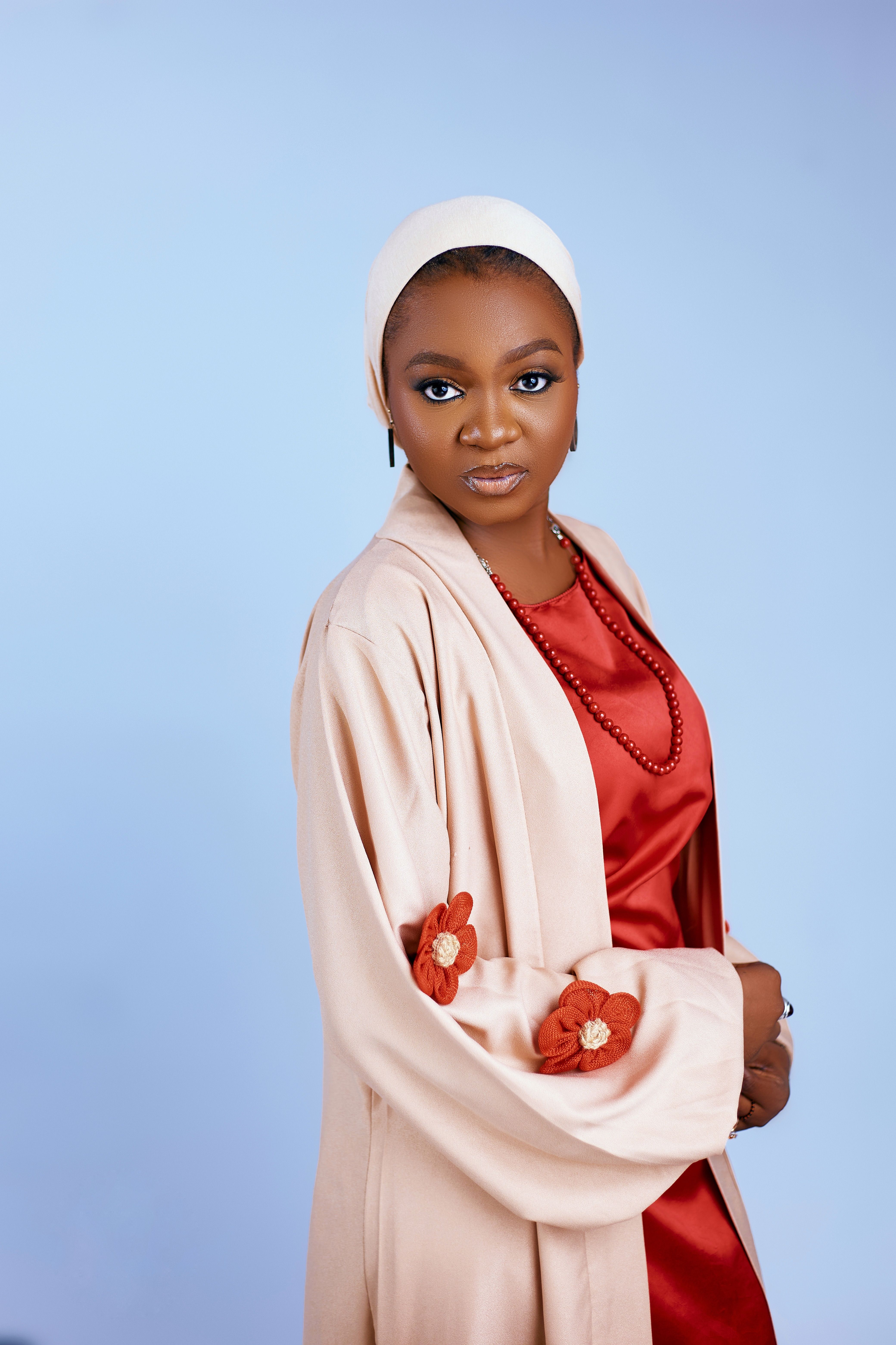 Elegant Portrait of Woman in Red and Cream Attire · Free Stock Photo