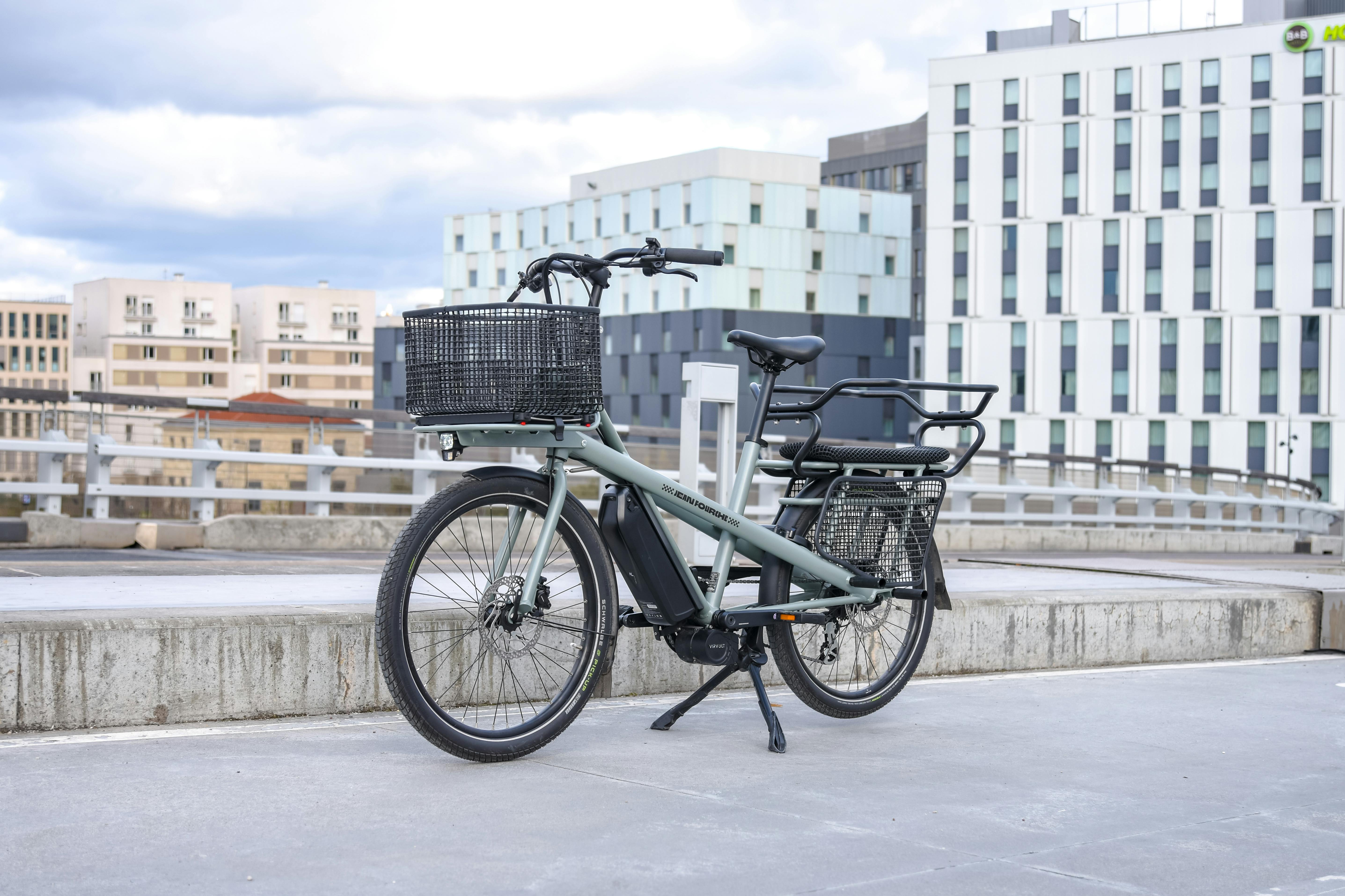 Electric Cargo Bike on City Rooftop in France · Free Stock Photo