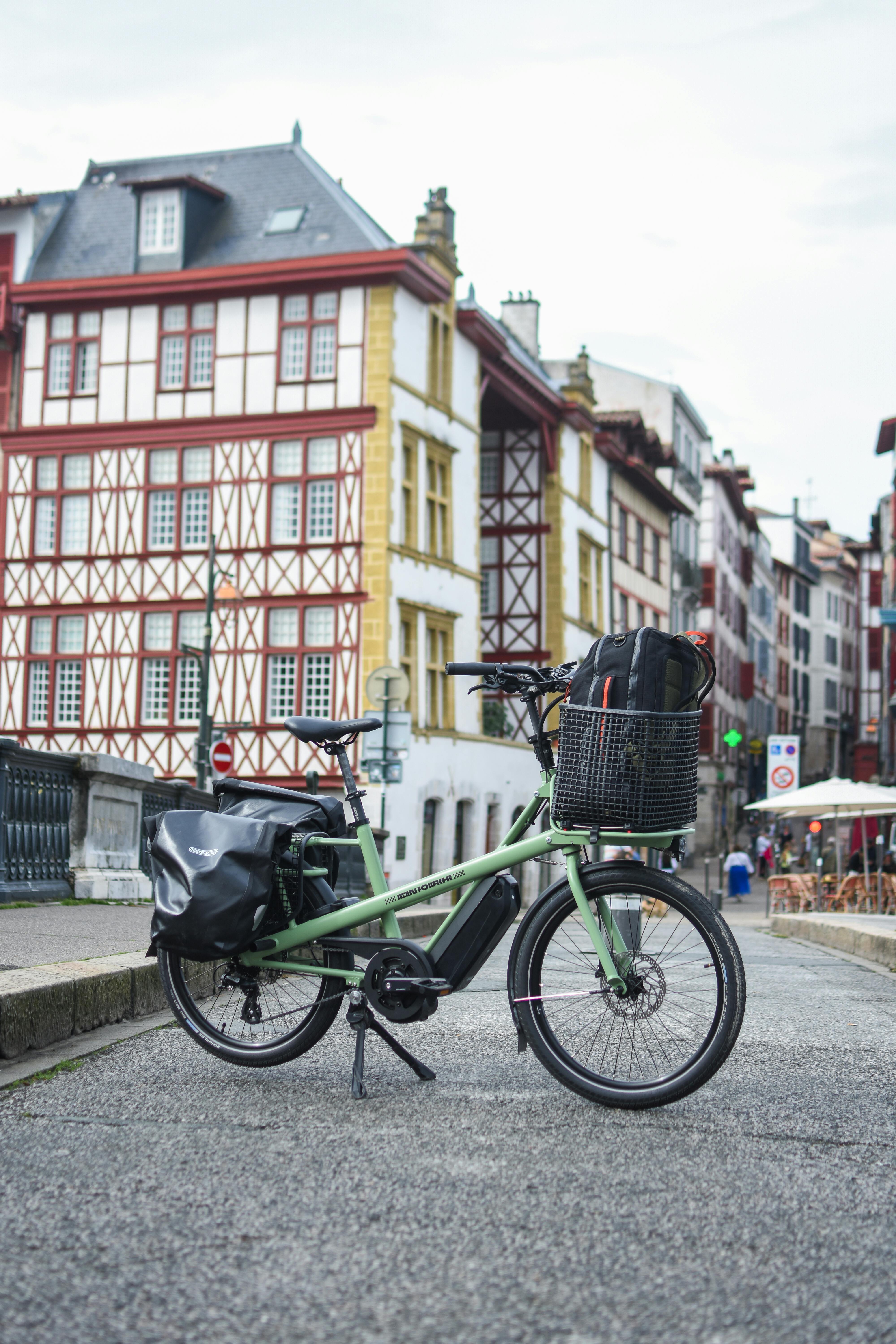 Green Cargo Bike in French Town Street · Free Stock Photo