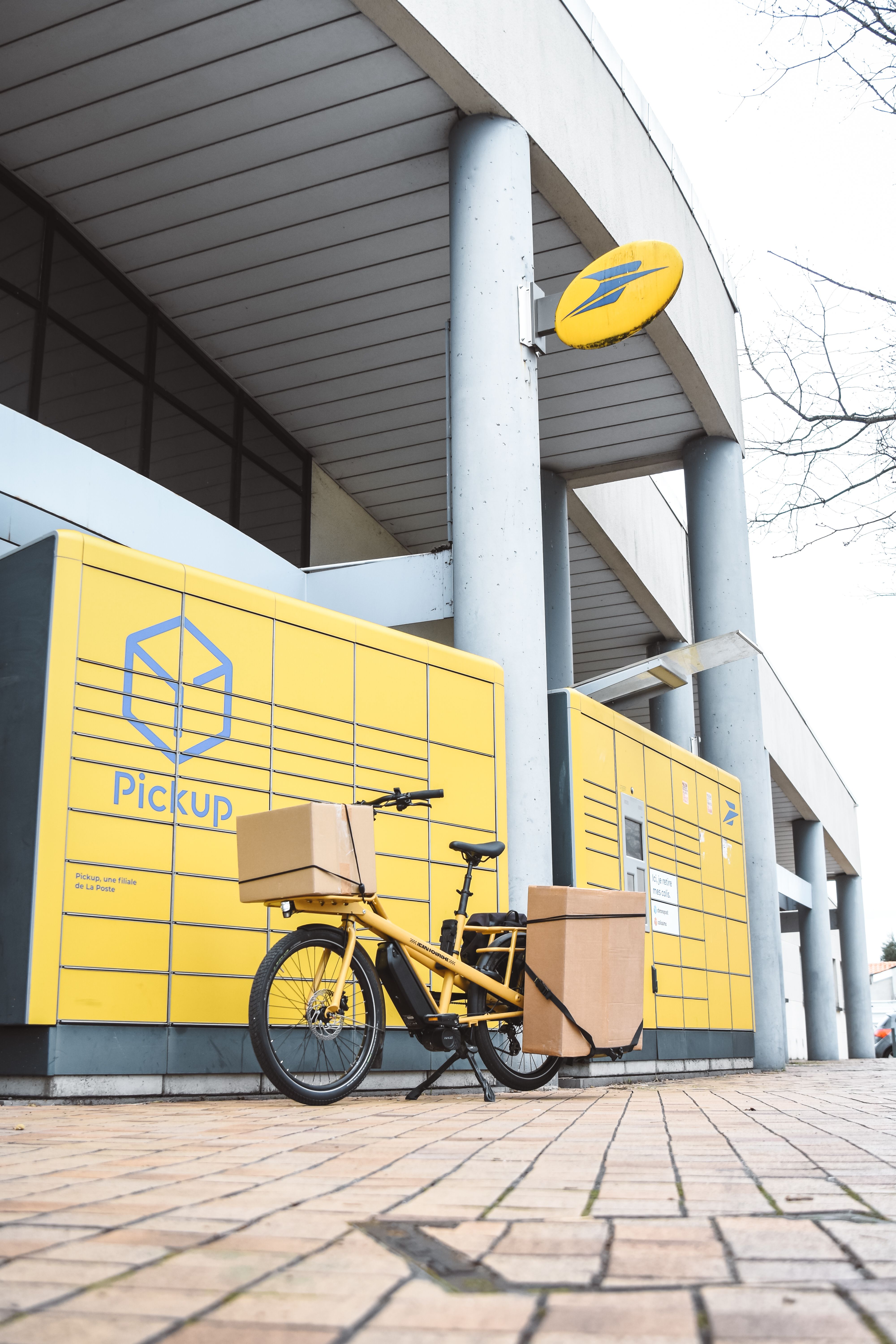 Cargo Bike at Parcel Pickup Location in France · Free Stock Photo
