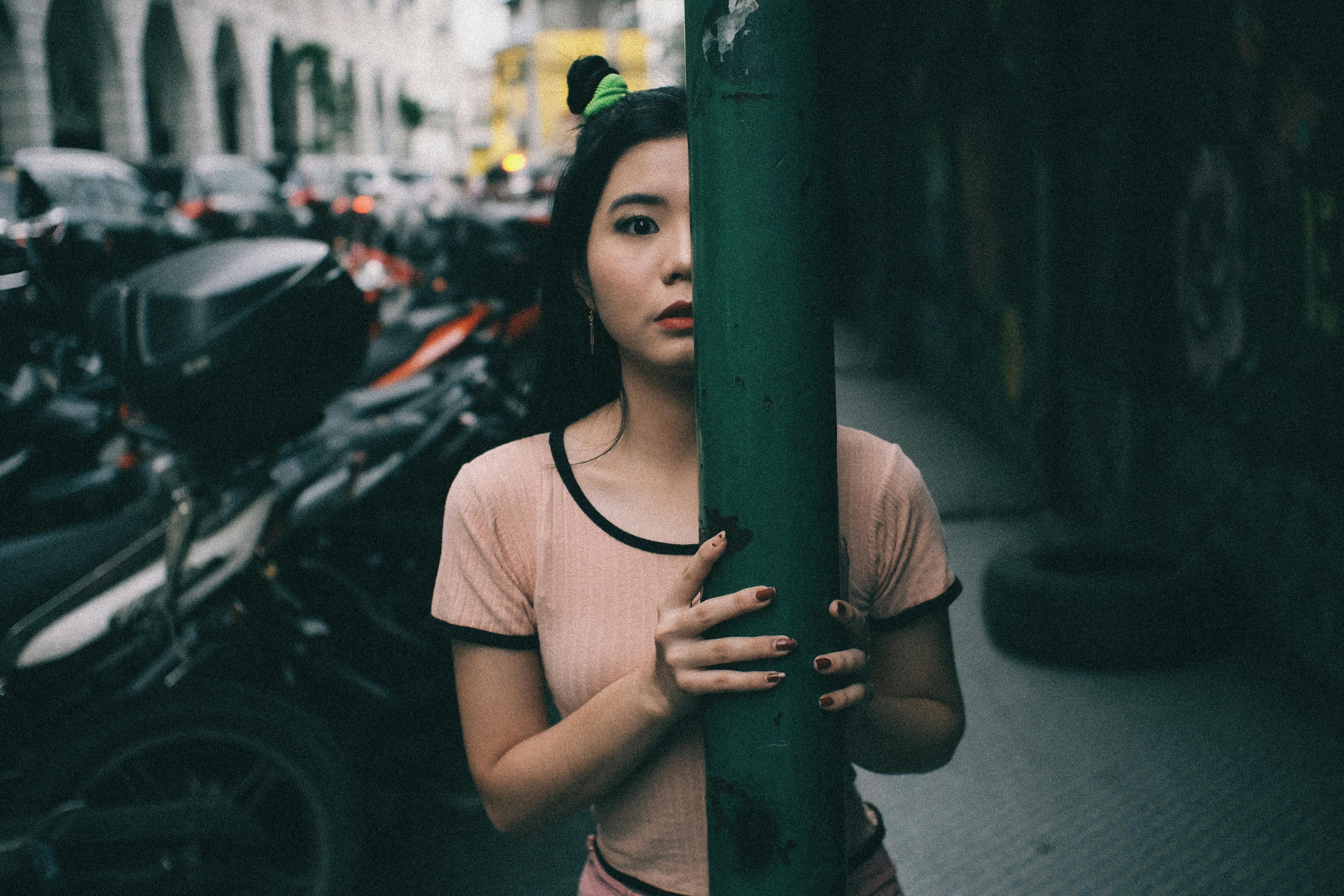 Woman Wearing Pink and Black Rim Crew-neck Shirt Standing Behind A ...