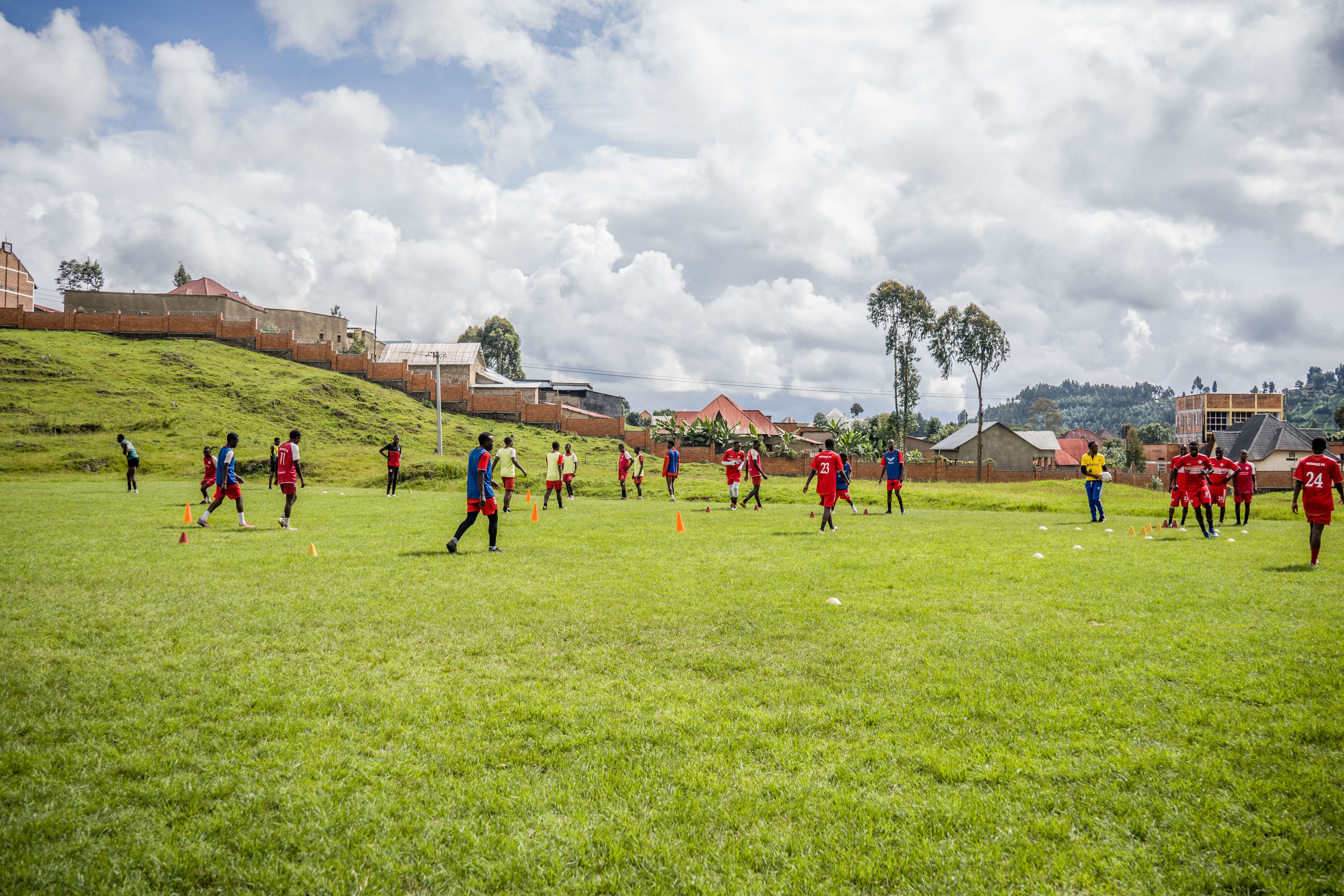 Group of Teenagers Playing Football on Field · Free Stock Photo
