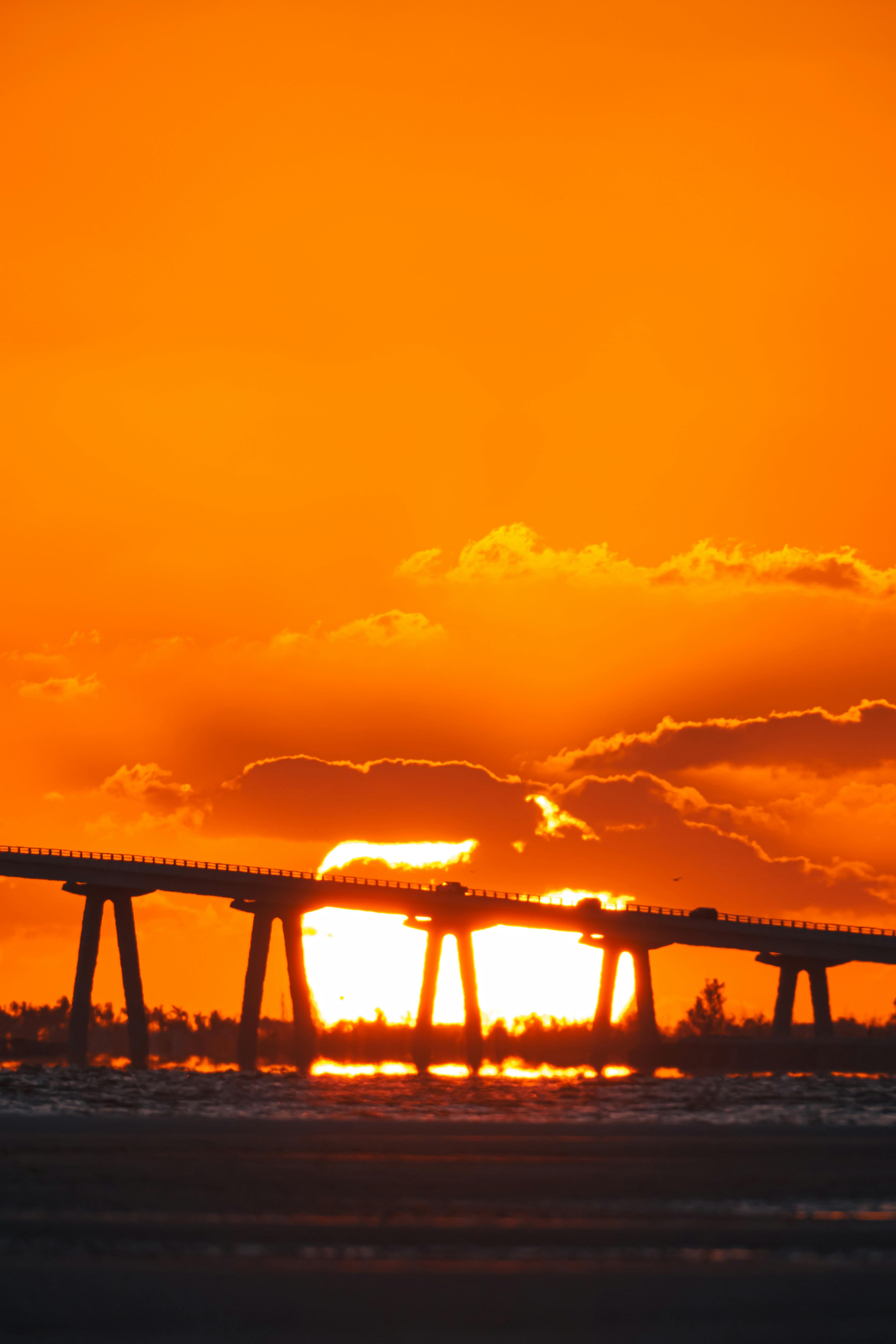 Vibrant Sunset Over Bridge in Florida · Free Stock Photo
