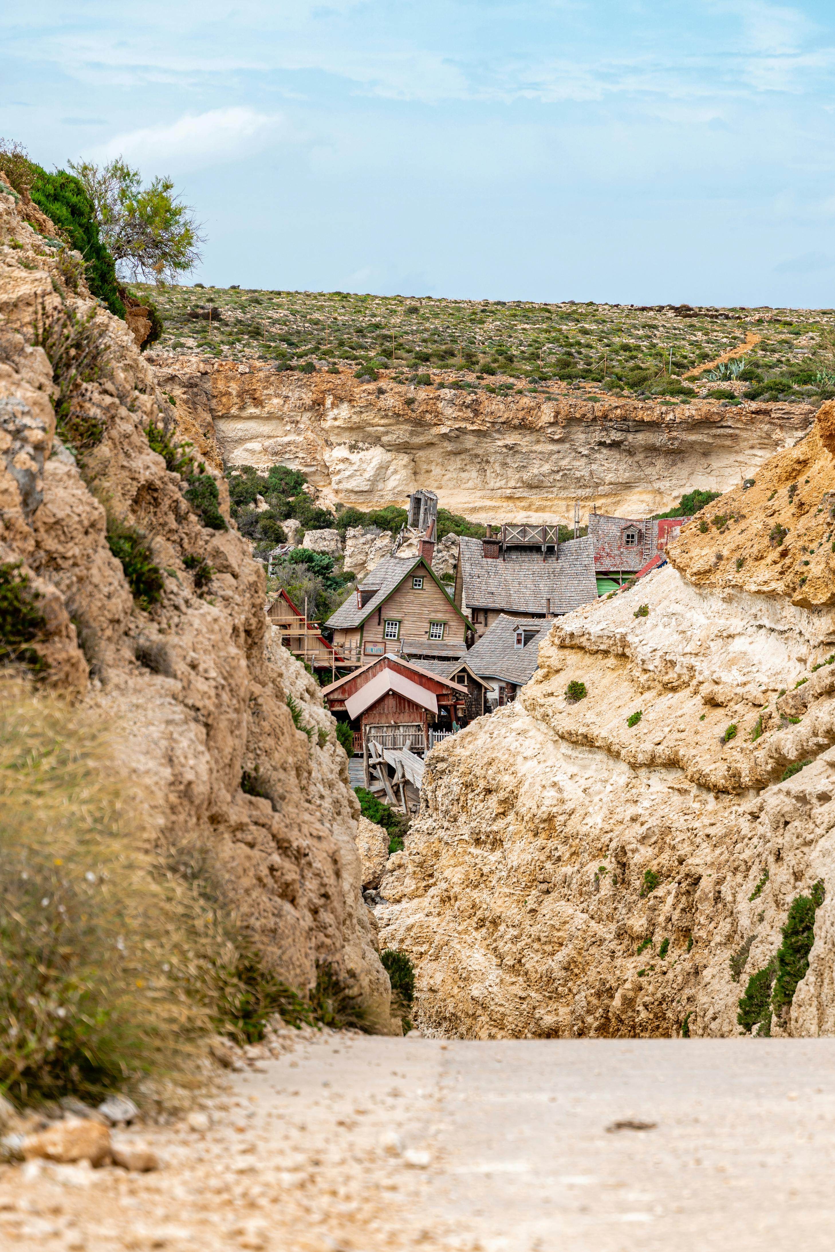 Charming Village View through Maltese Cliffs · Free Stock Photo