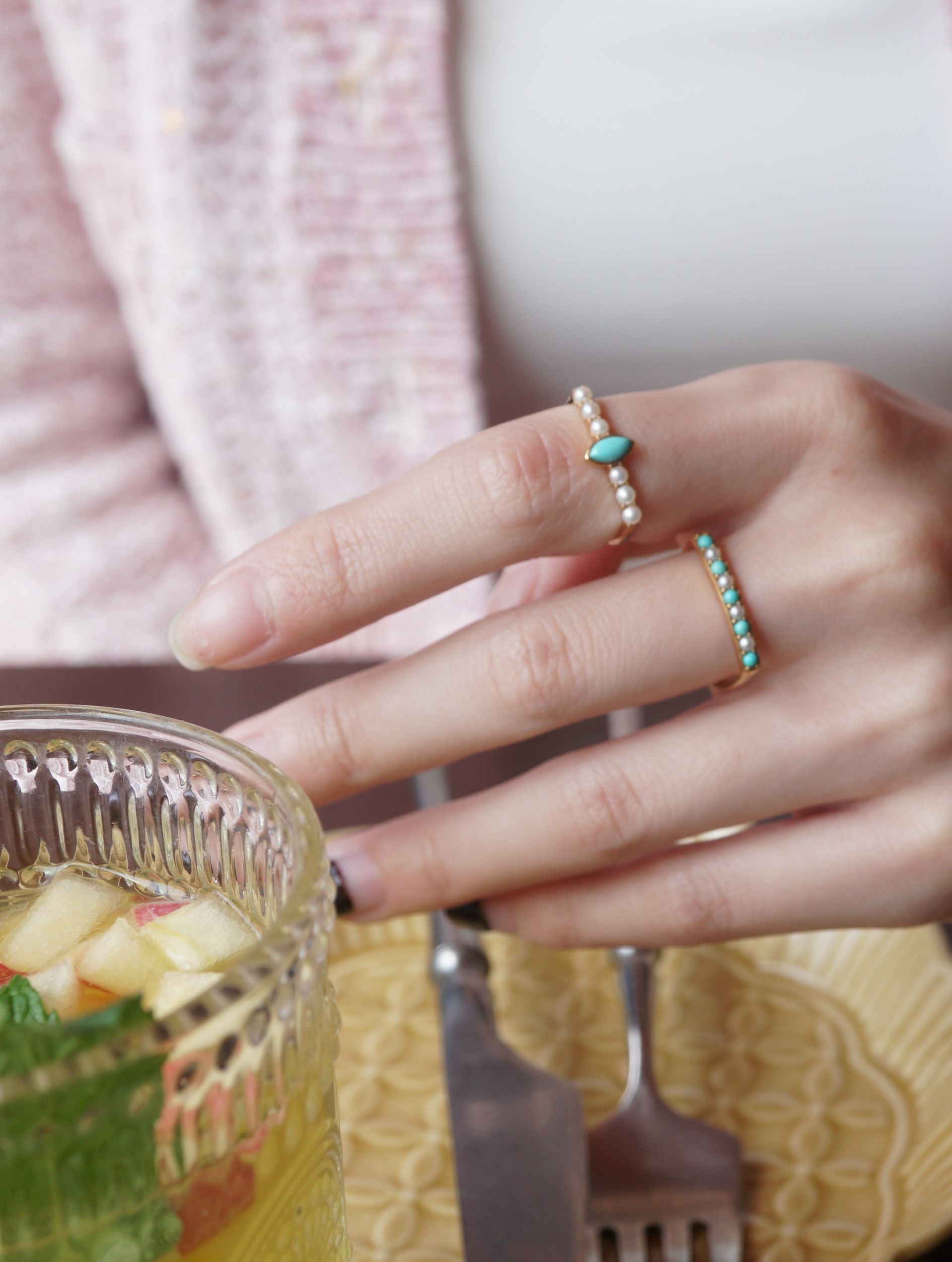 Elegant Hand with Jewelry in Café Setting · Free Stock Photo