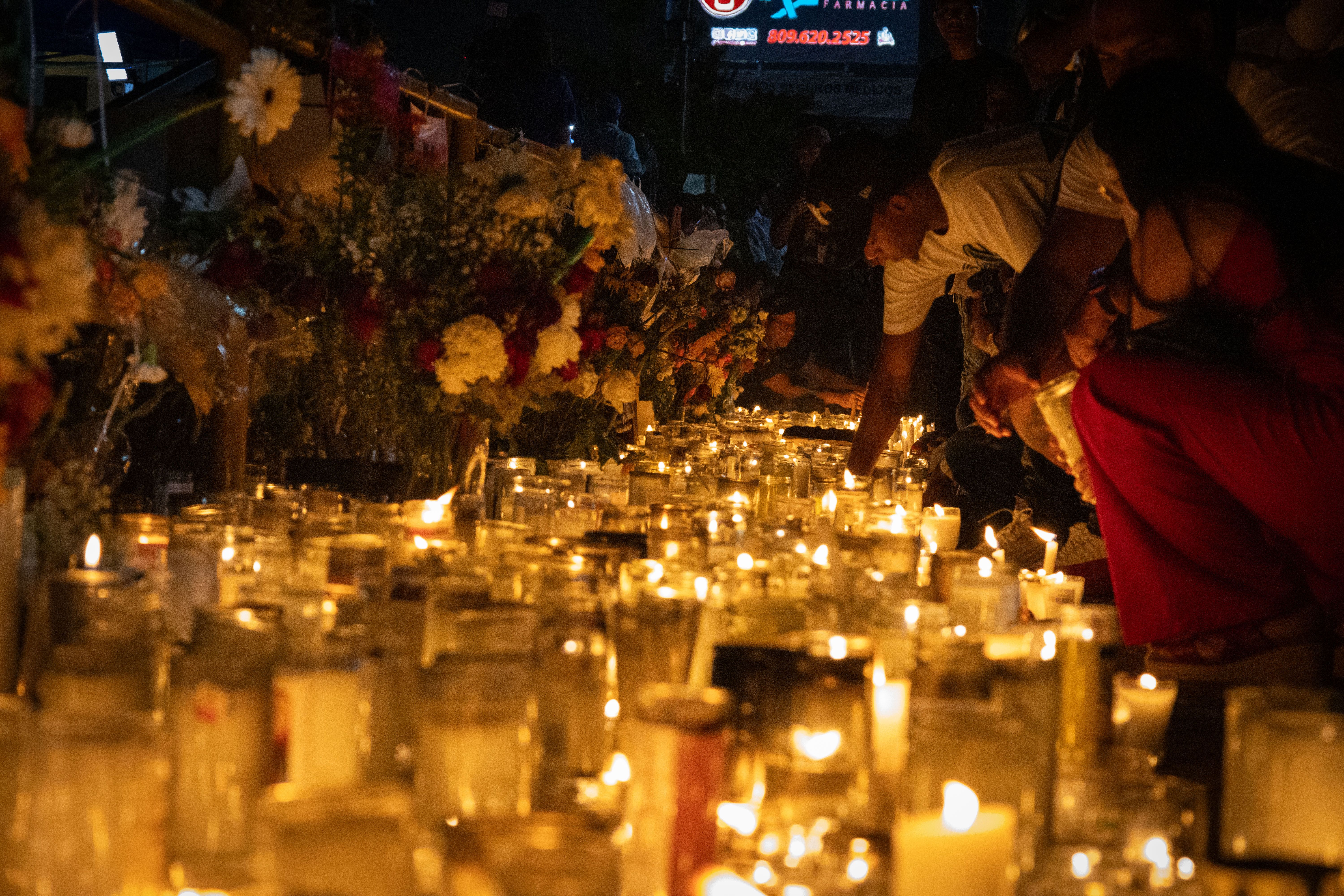 Vigil with Candlelit Flowers at Night · Free Stock Photo