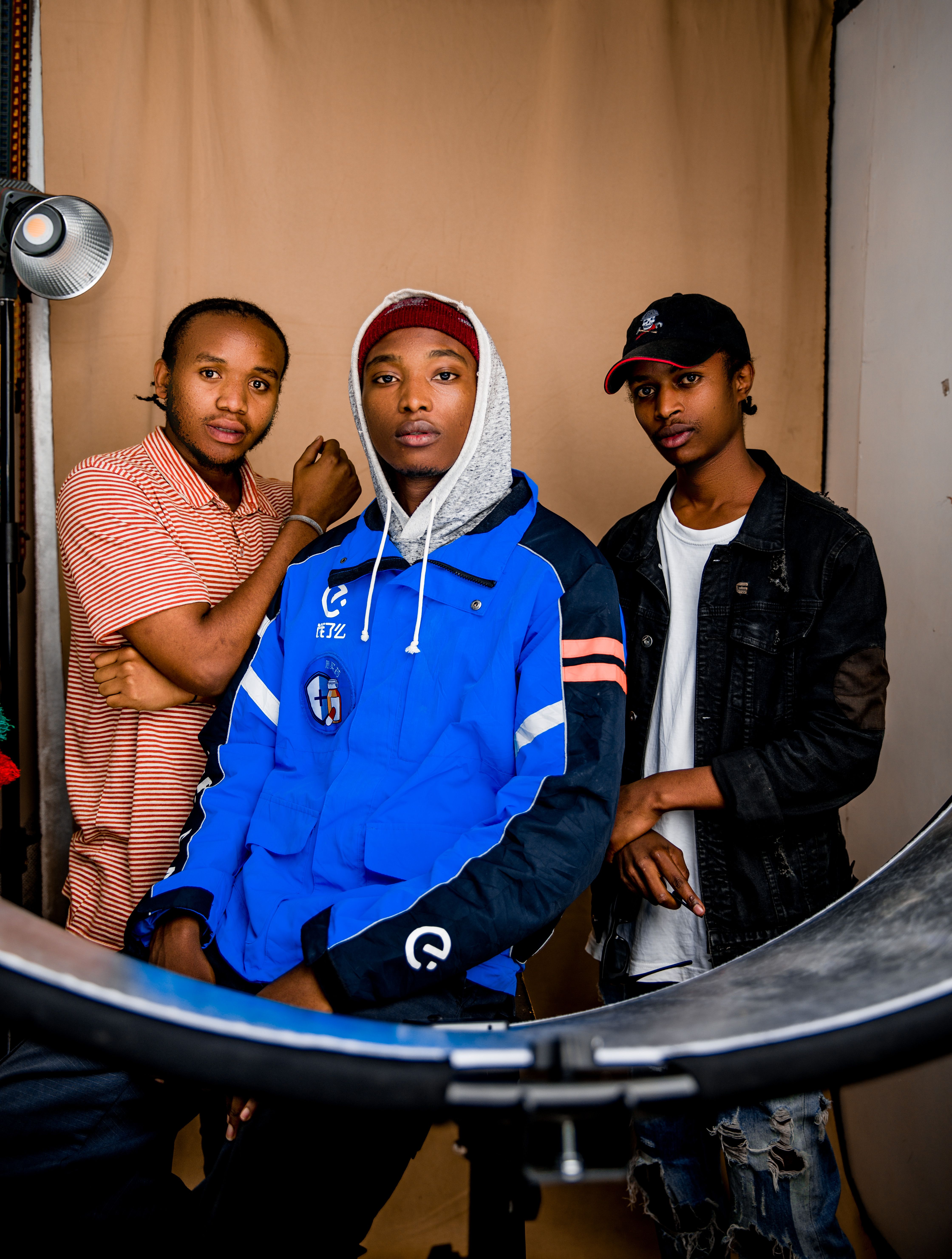 Portrait of Three Young Men in Studio Setting · Free Stock Photo