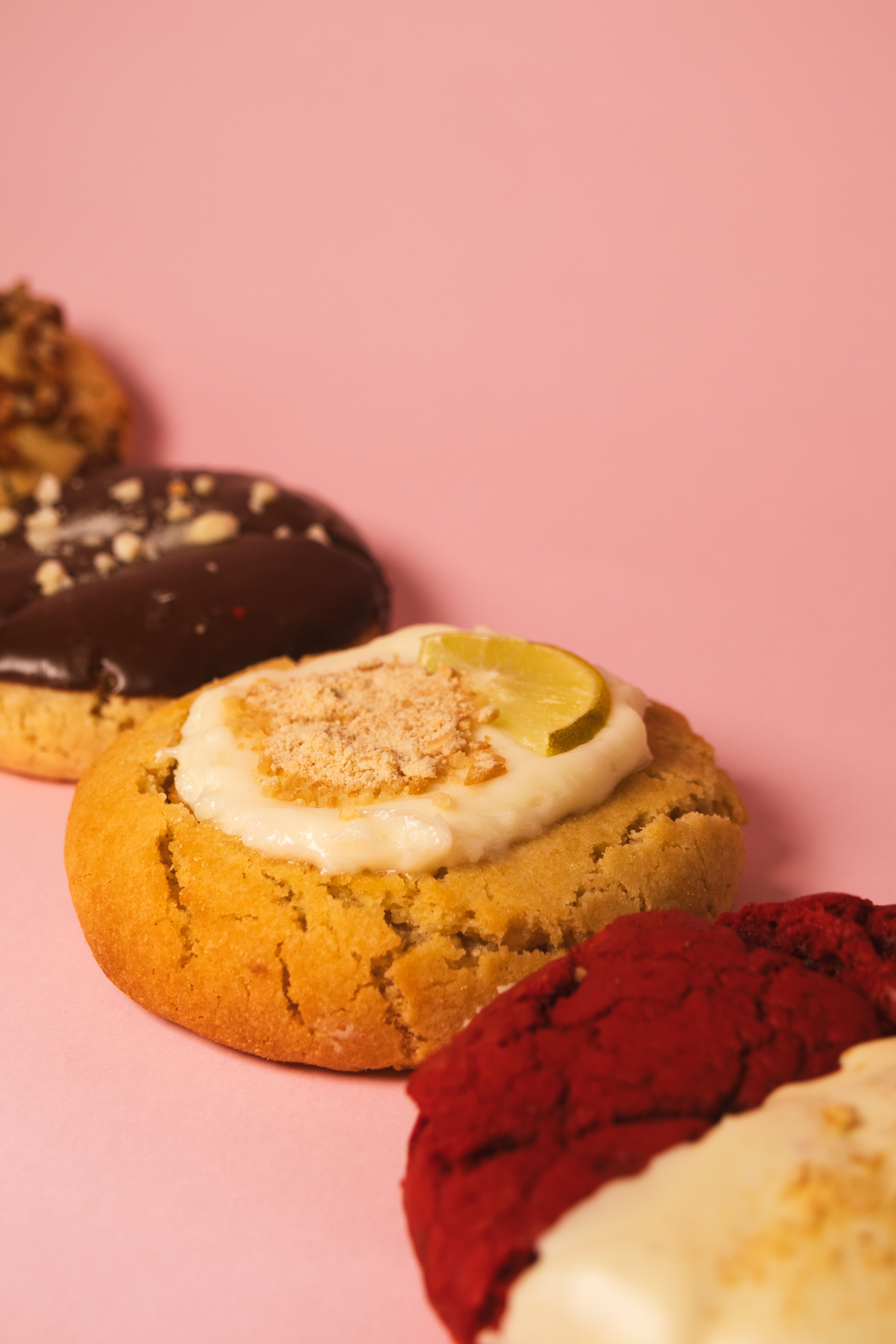 Assorted Cookies with Toppings on Pink Background · Free Stock Photo