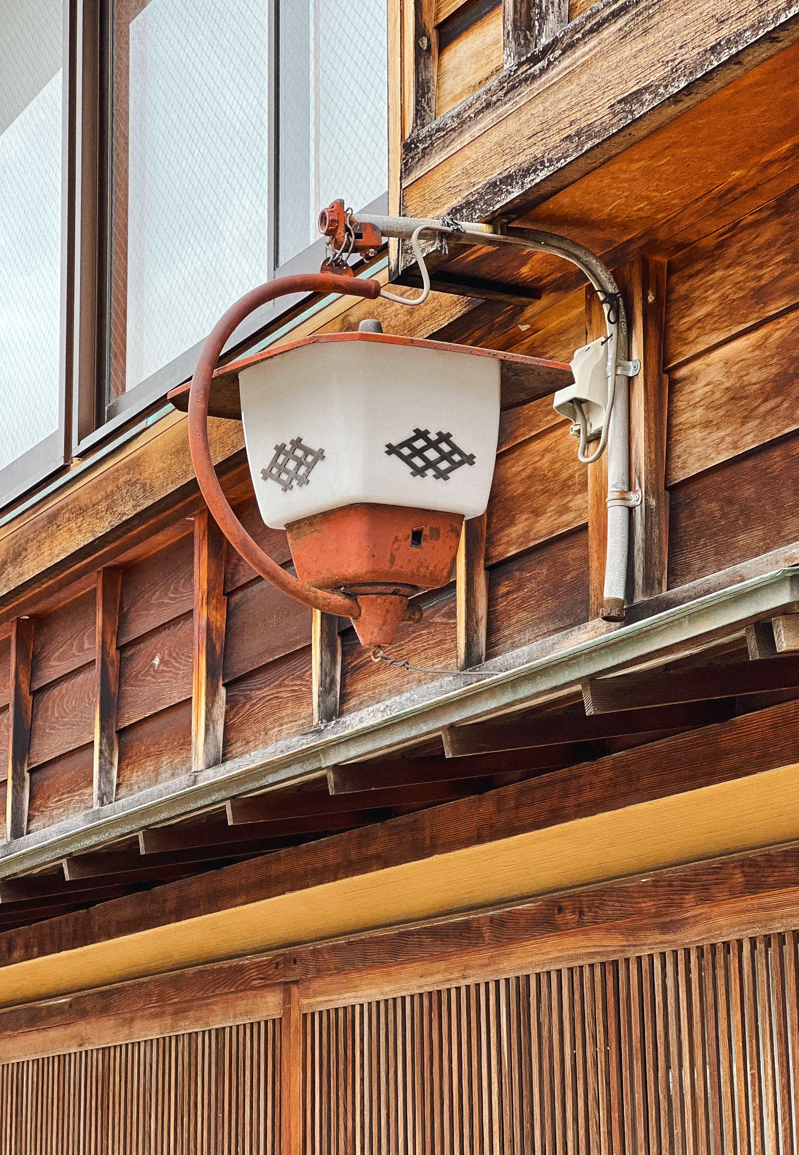 Traditional Japanese Wooden Lamp on Building Facade · Free Stock Photo