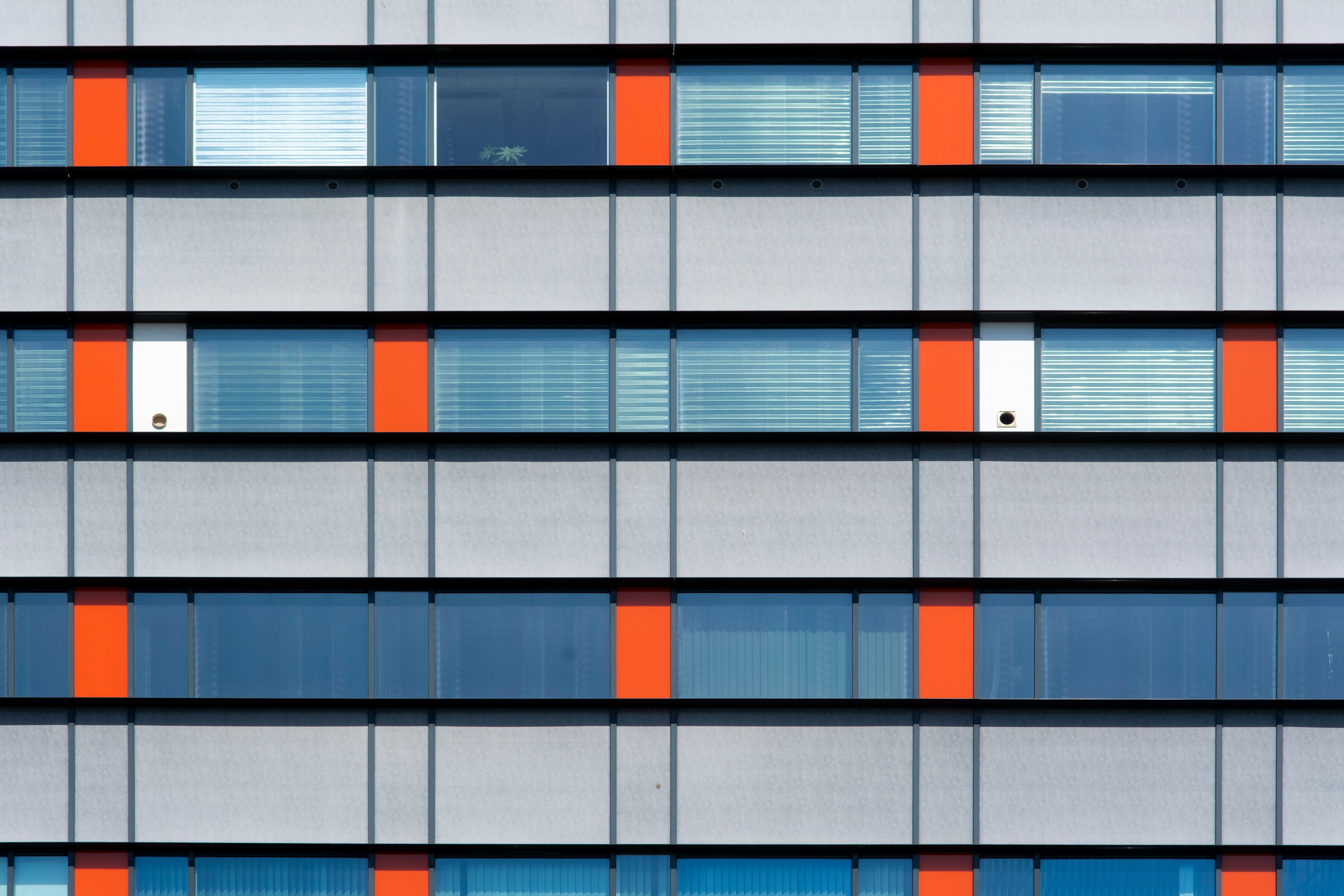Modern Building Facade with Geometric Patterns · Free Stock Photo