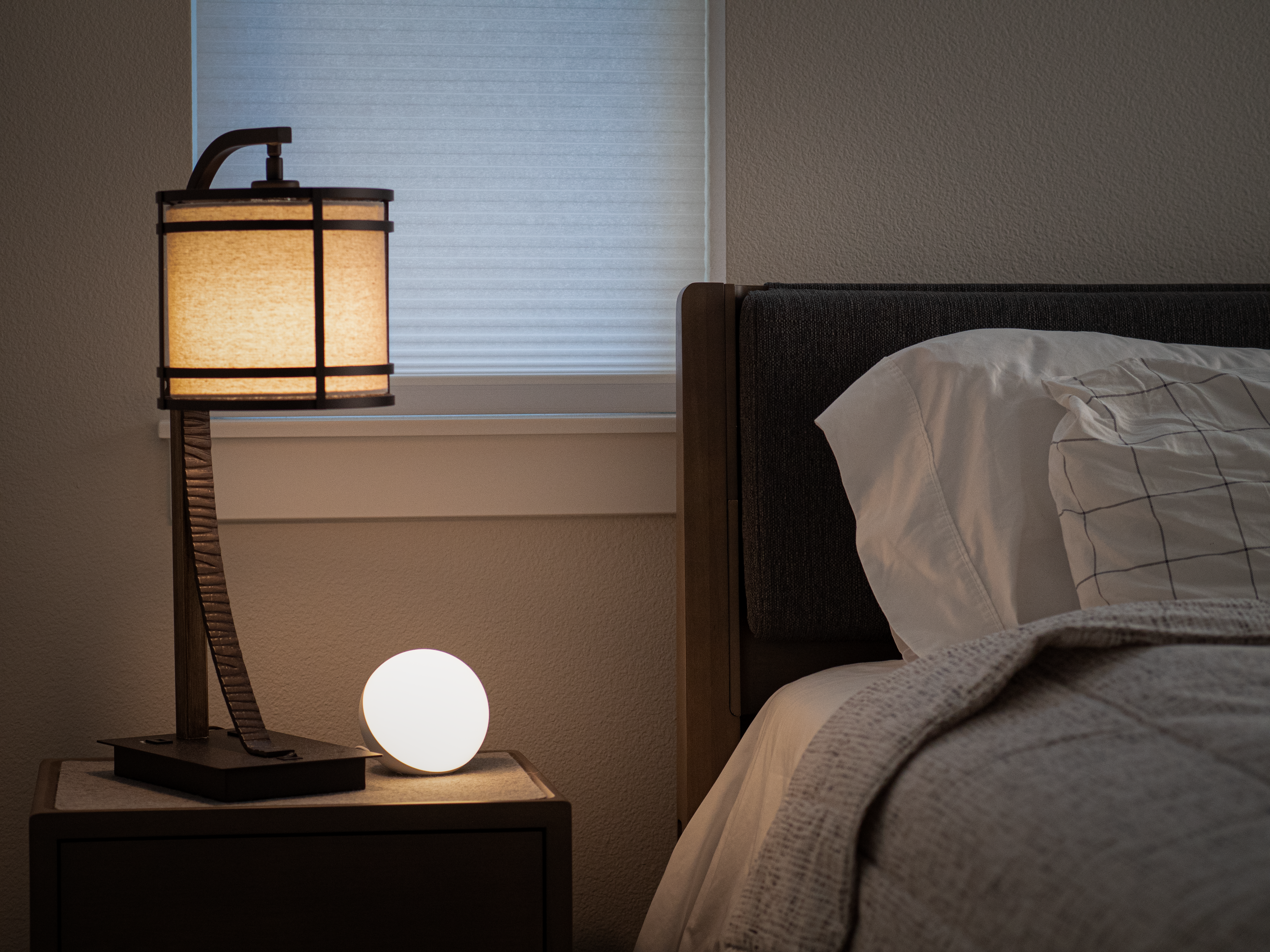 Cozy Bedroom Nightstand with Warm Lighting · Free Stock Photo