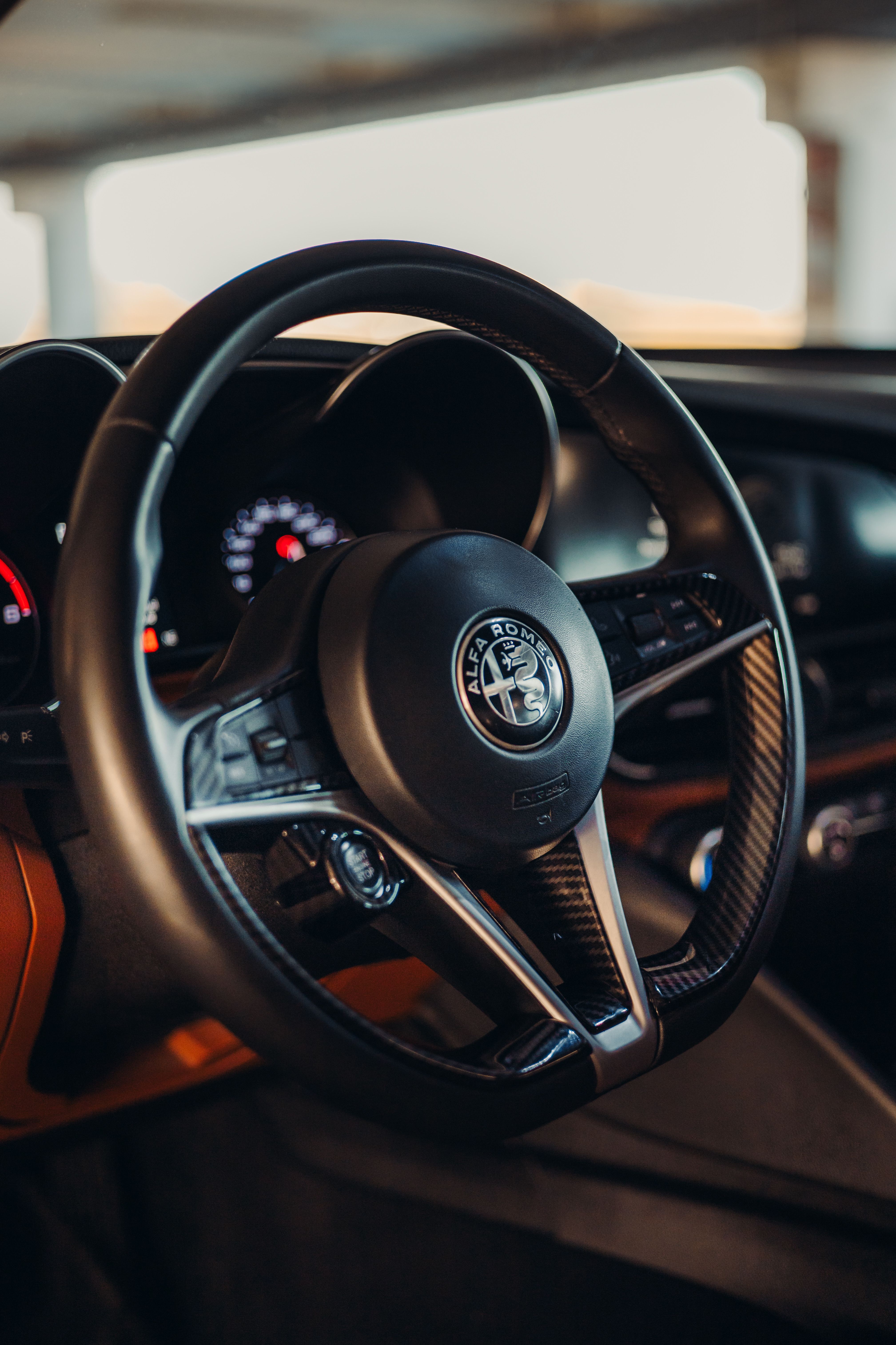 Close-up of a Car Steering Wheel in Luxury Vehicle · Free Stock Photo