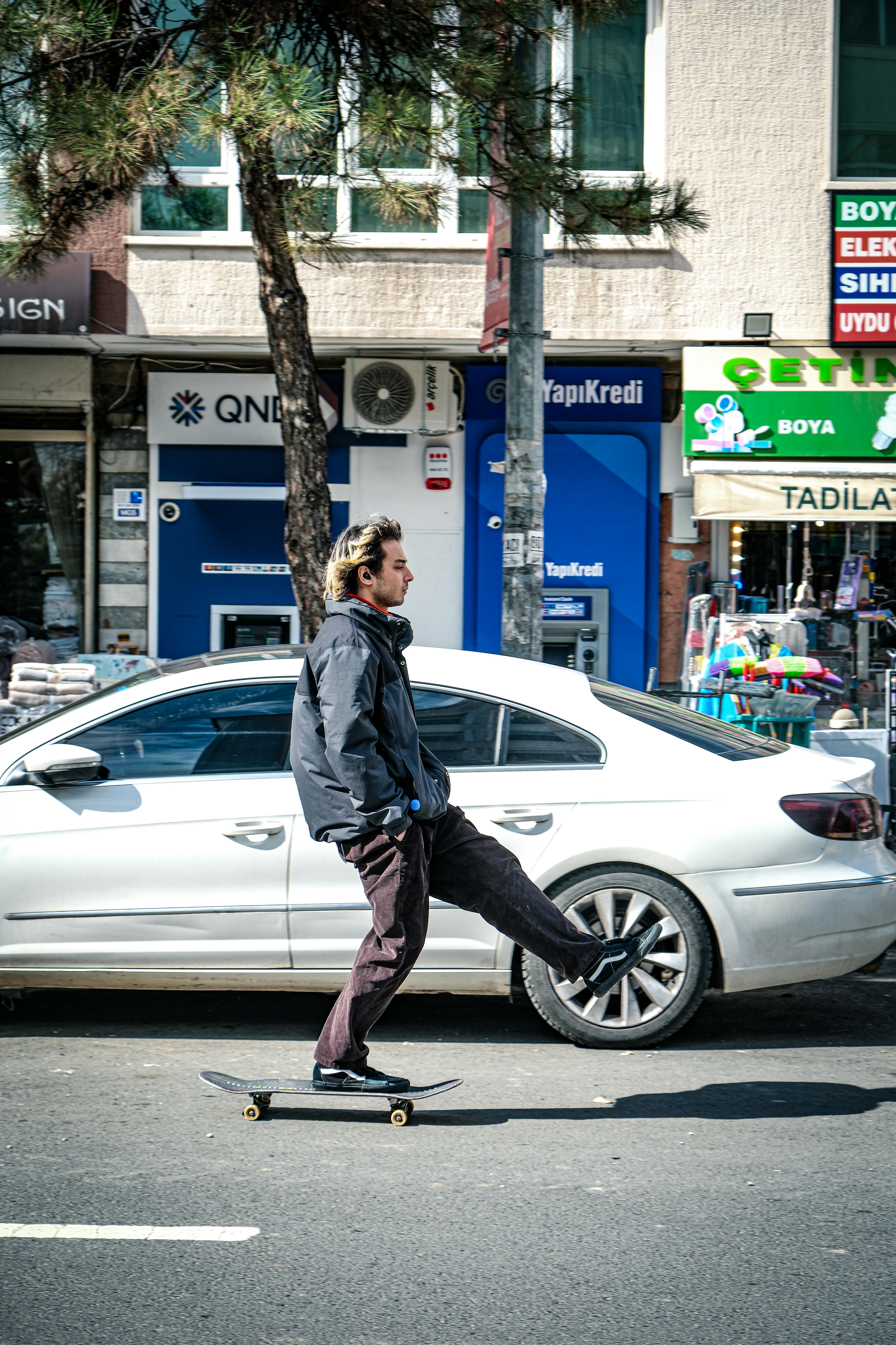 Skateboarder on Ankara Street with Car · Free Stock Photo