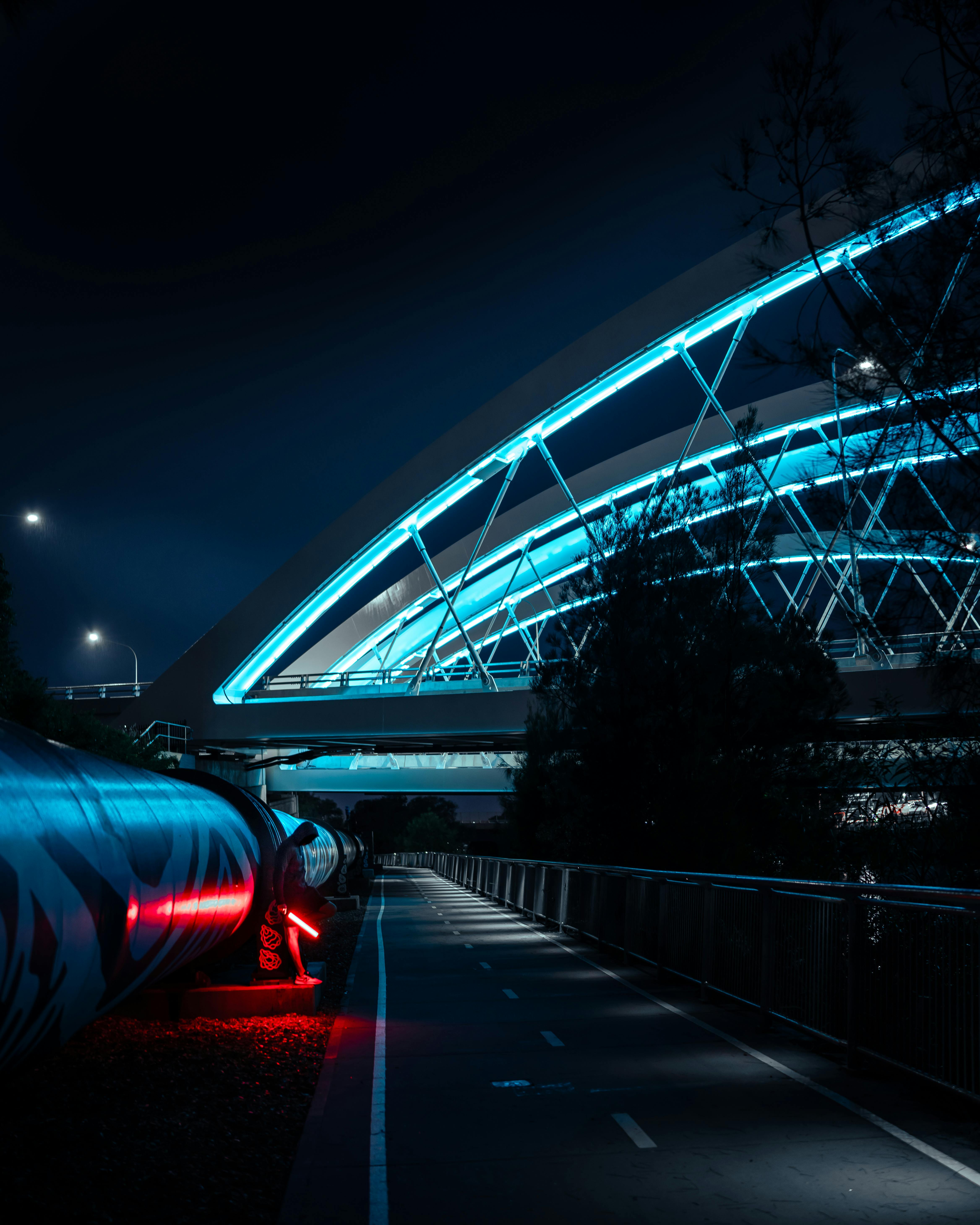 Illuminated Modern Bridge at Night with Neon Lights · Free Stock Photo