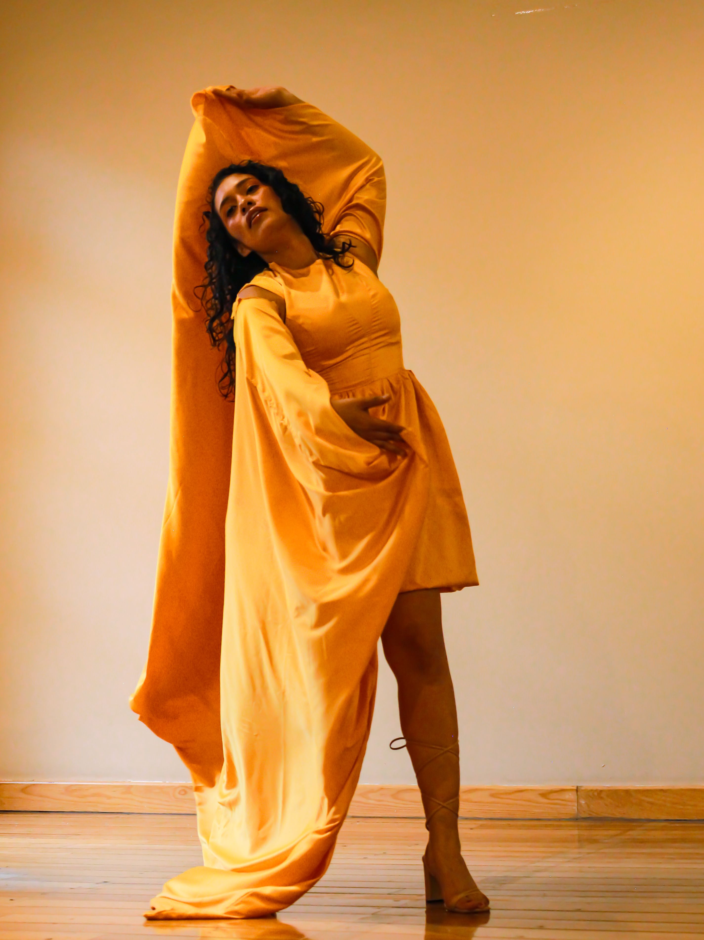 Elegant Woman in Vibrant Yellow Dress Indoors · Free Stock Photo