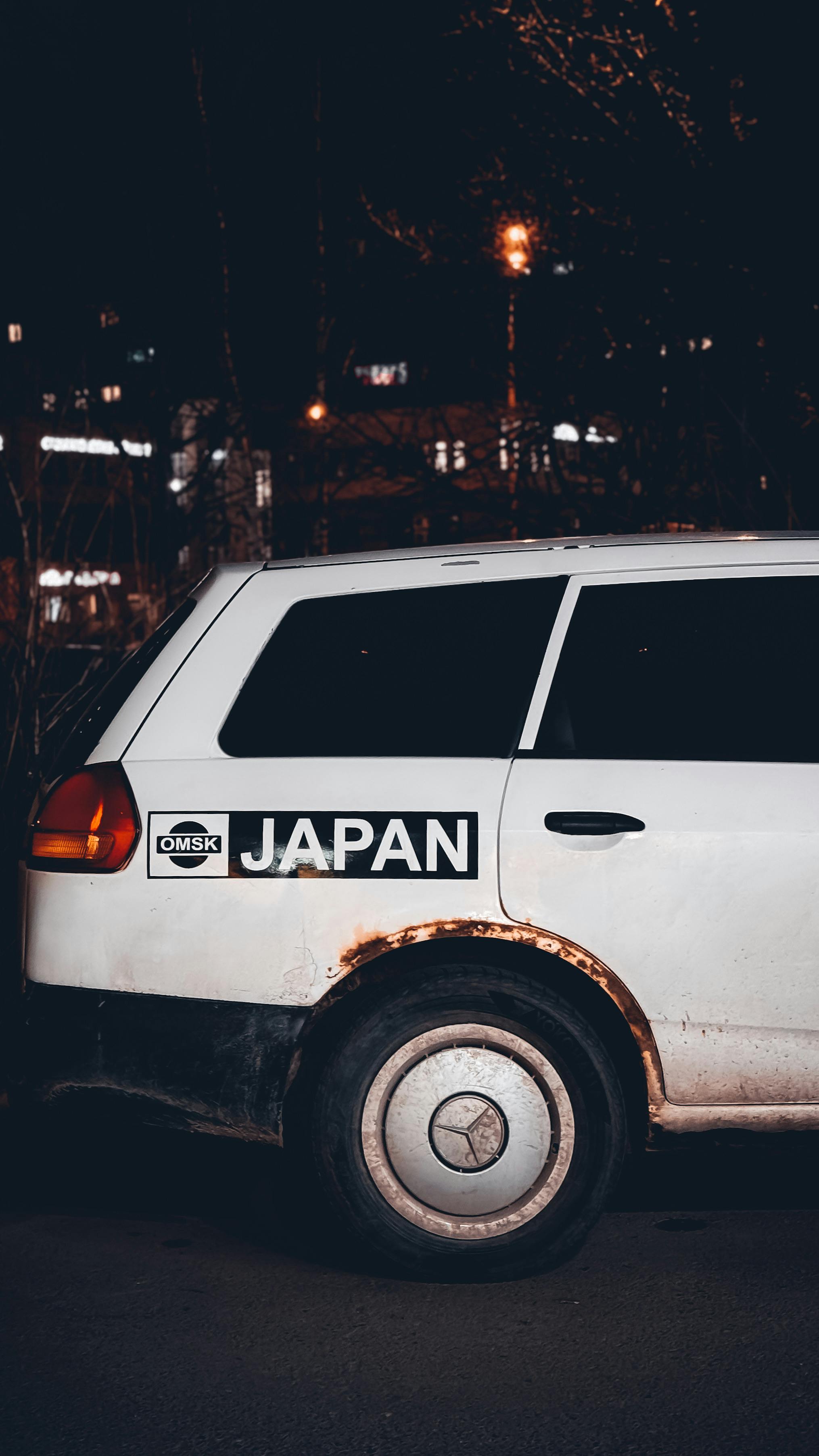 Rusty Car with Japan Emblem at Night · Free Stock Photo