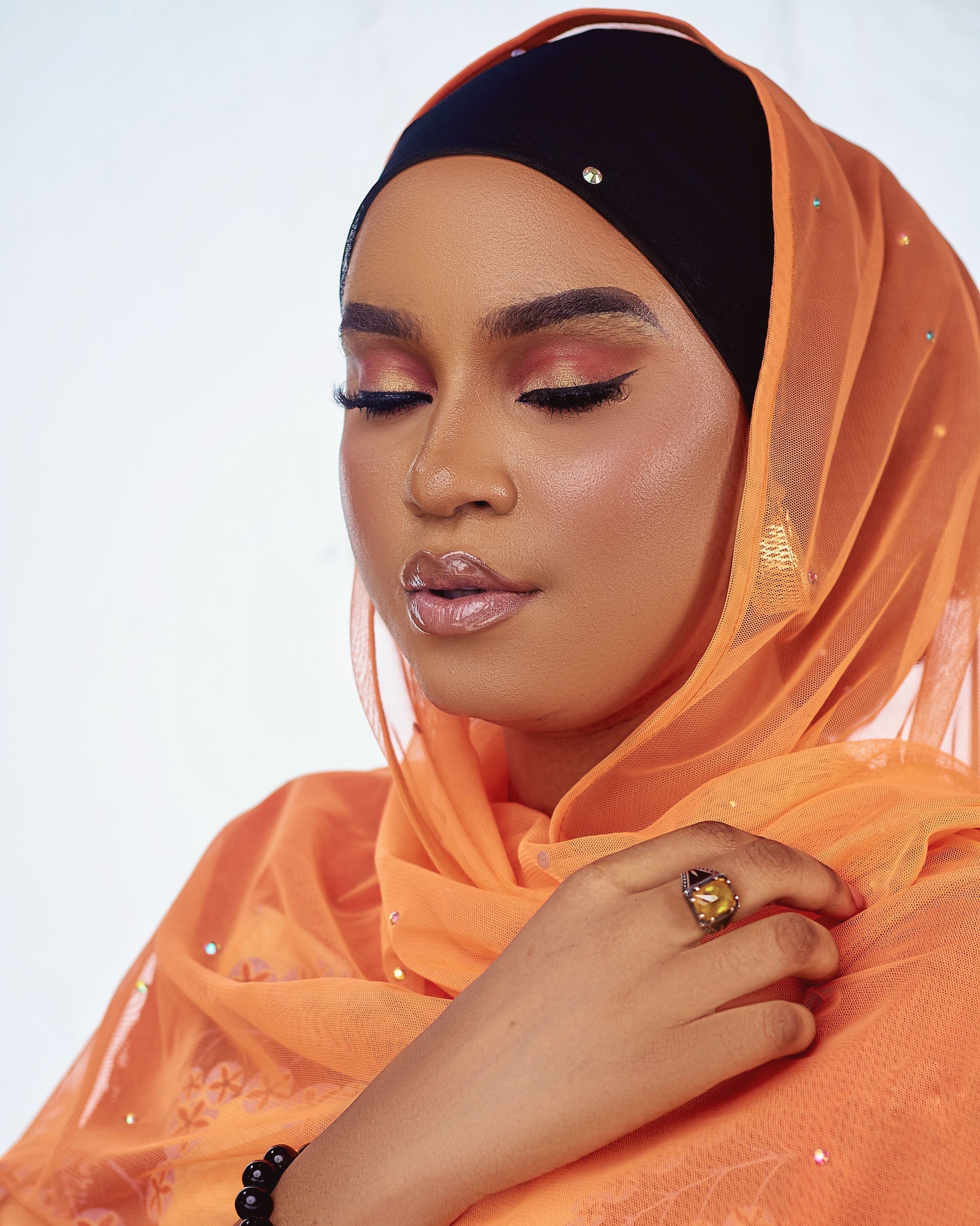Elegant Portrait of Woman in Orange Hijab · Free Stock Photo