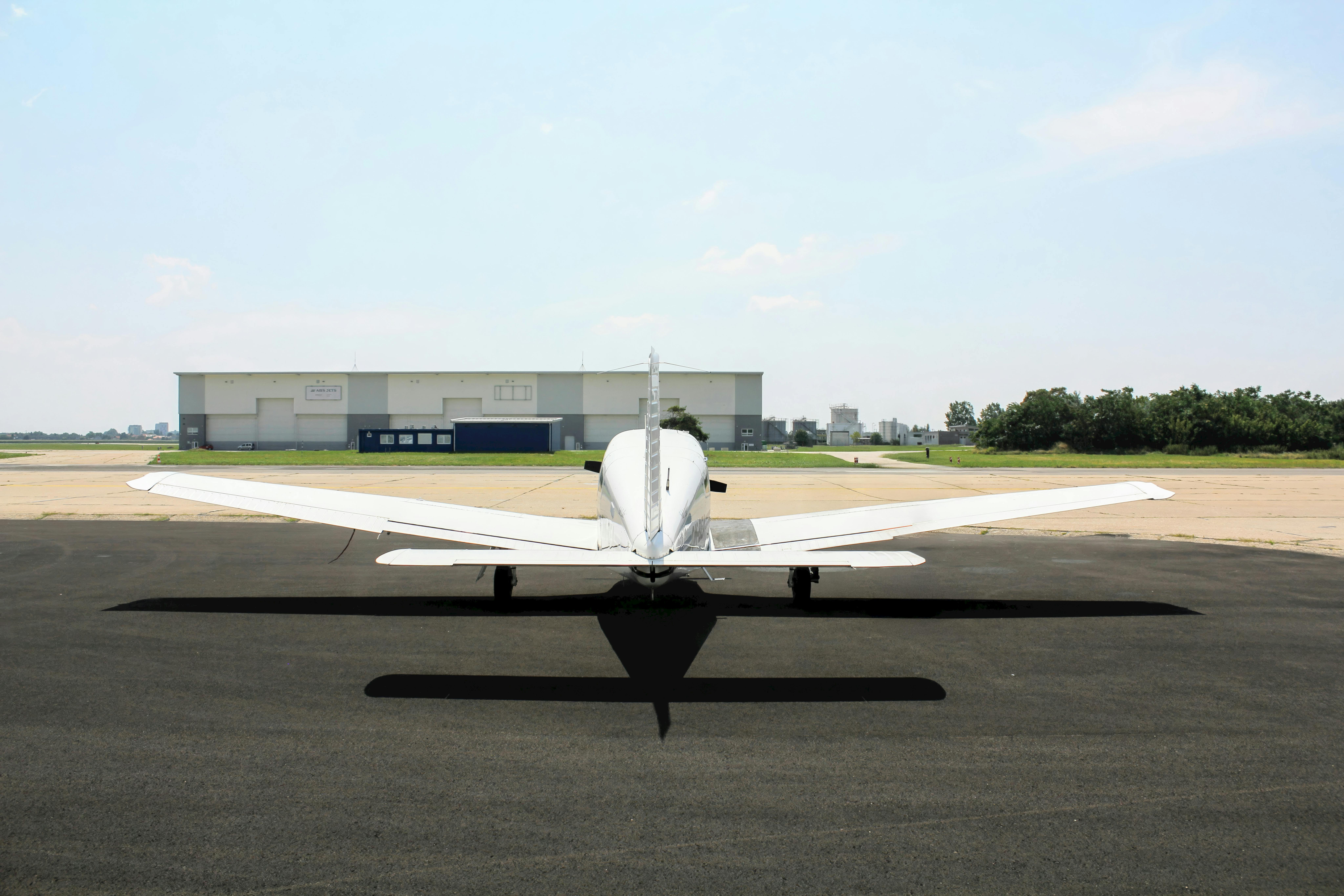 Small Aircraft on Runway in Summer Daylight · Free Stock Photo