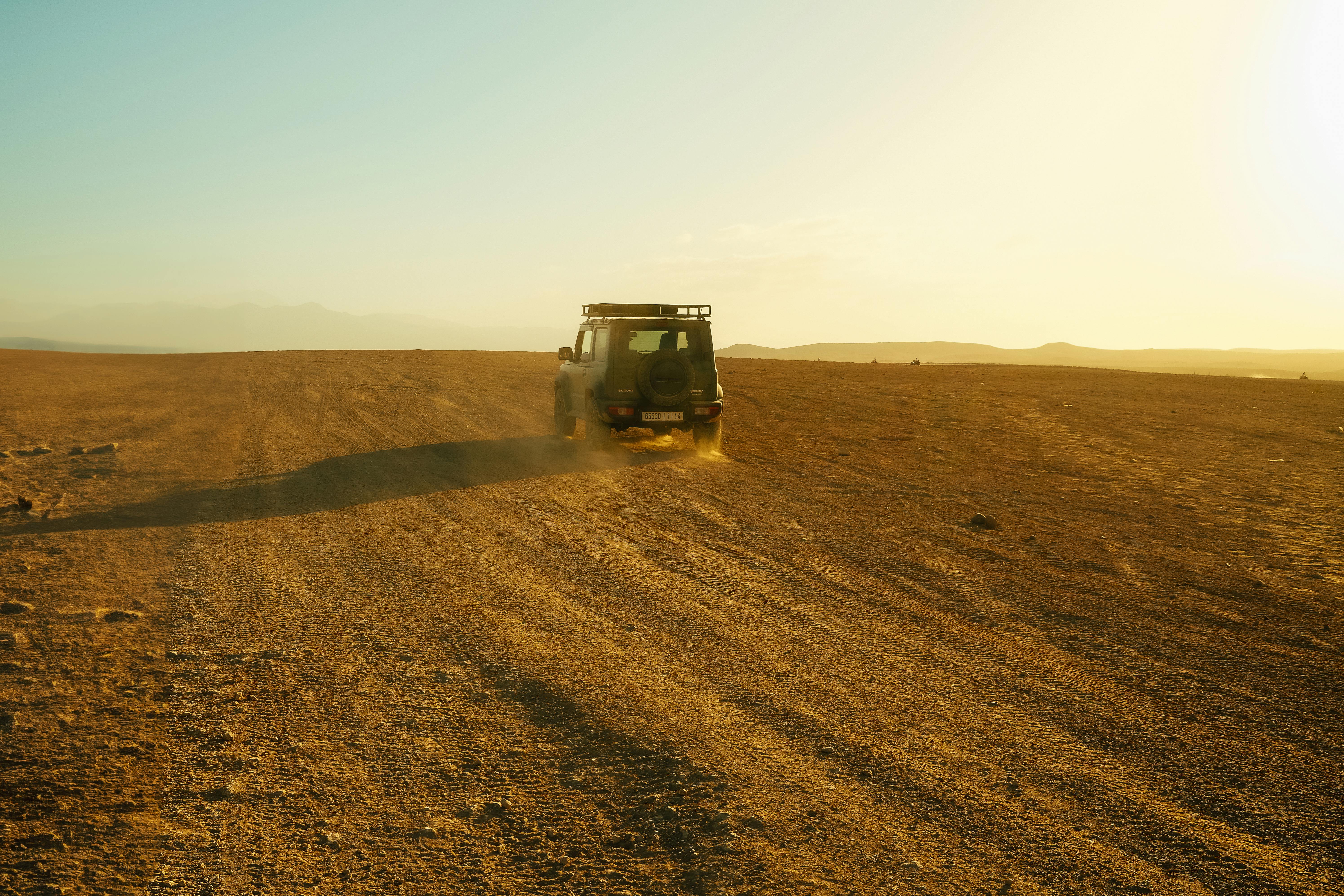 Off-Road Adventure in a Sunlit Desert Landscape · Free Stock Photo